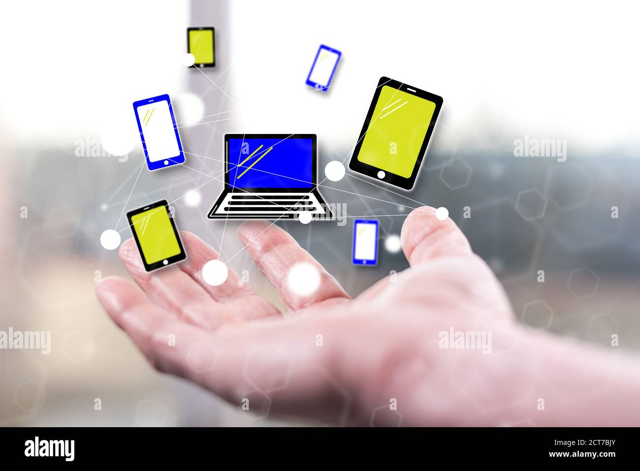 Devices connection concept above a hand of a man Stock Photo - Alamy