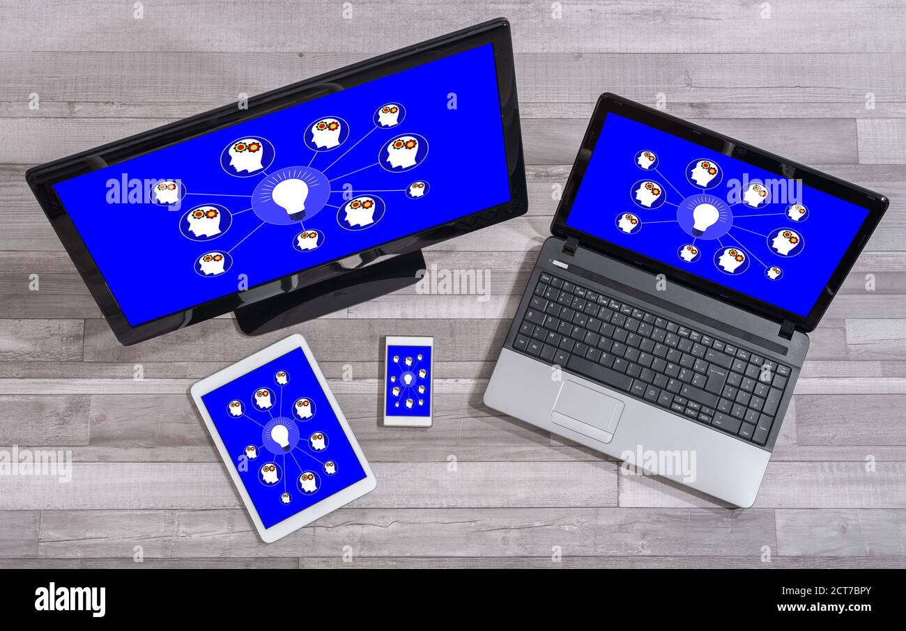 Brainstorming concept shown on different information technology devices ...