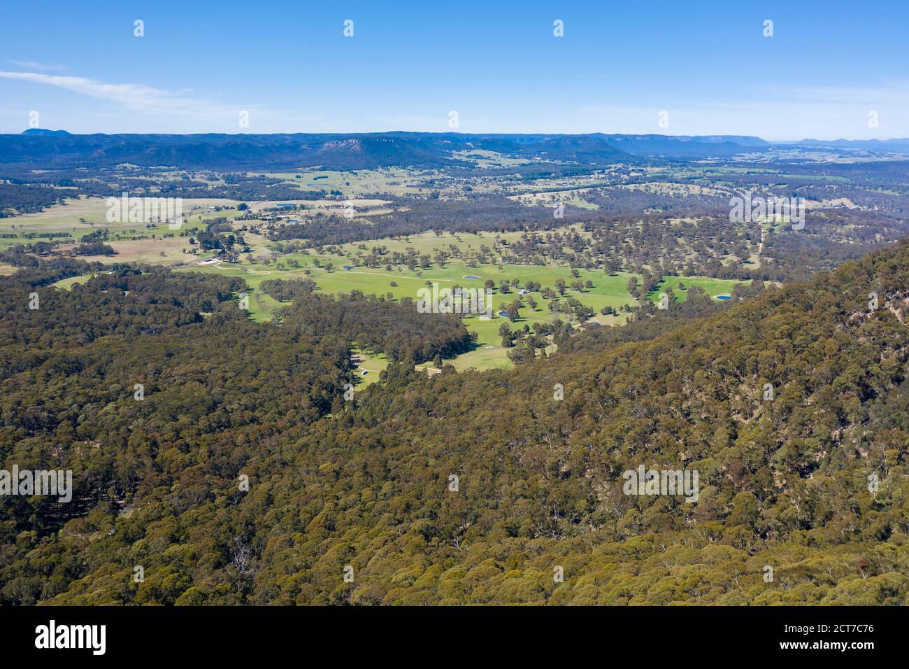 Aerial view of a large green agricultural valley in the Central ...