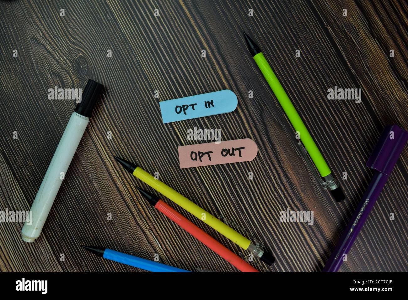 Opt In or Opt Out text on sticky notes with office desk Stock Photo - Alamy