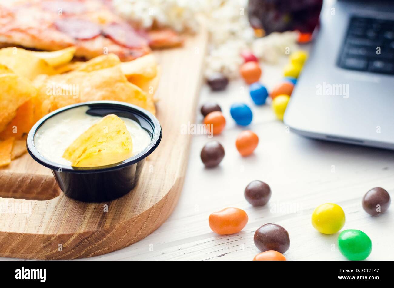 Working at home and snacks. Home office with unhealthy lifestyle ...