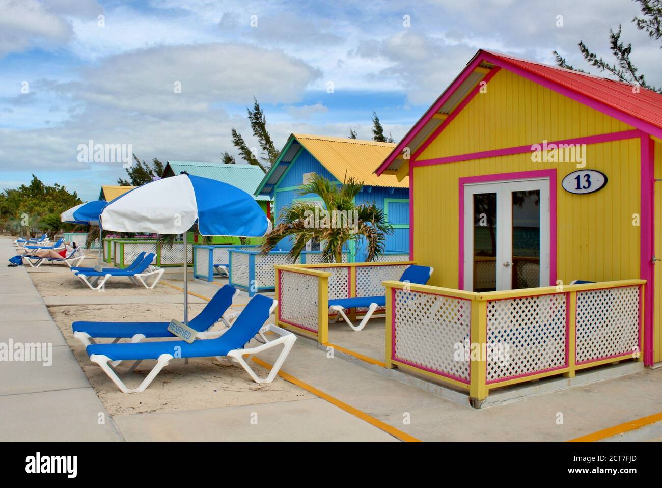 Beach Cabanas, lounge chairs, and palm trees along the beach in ...