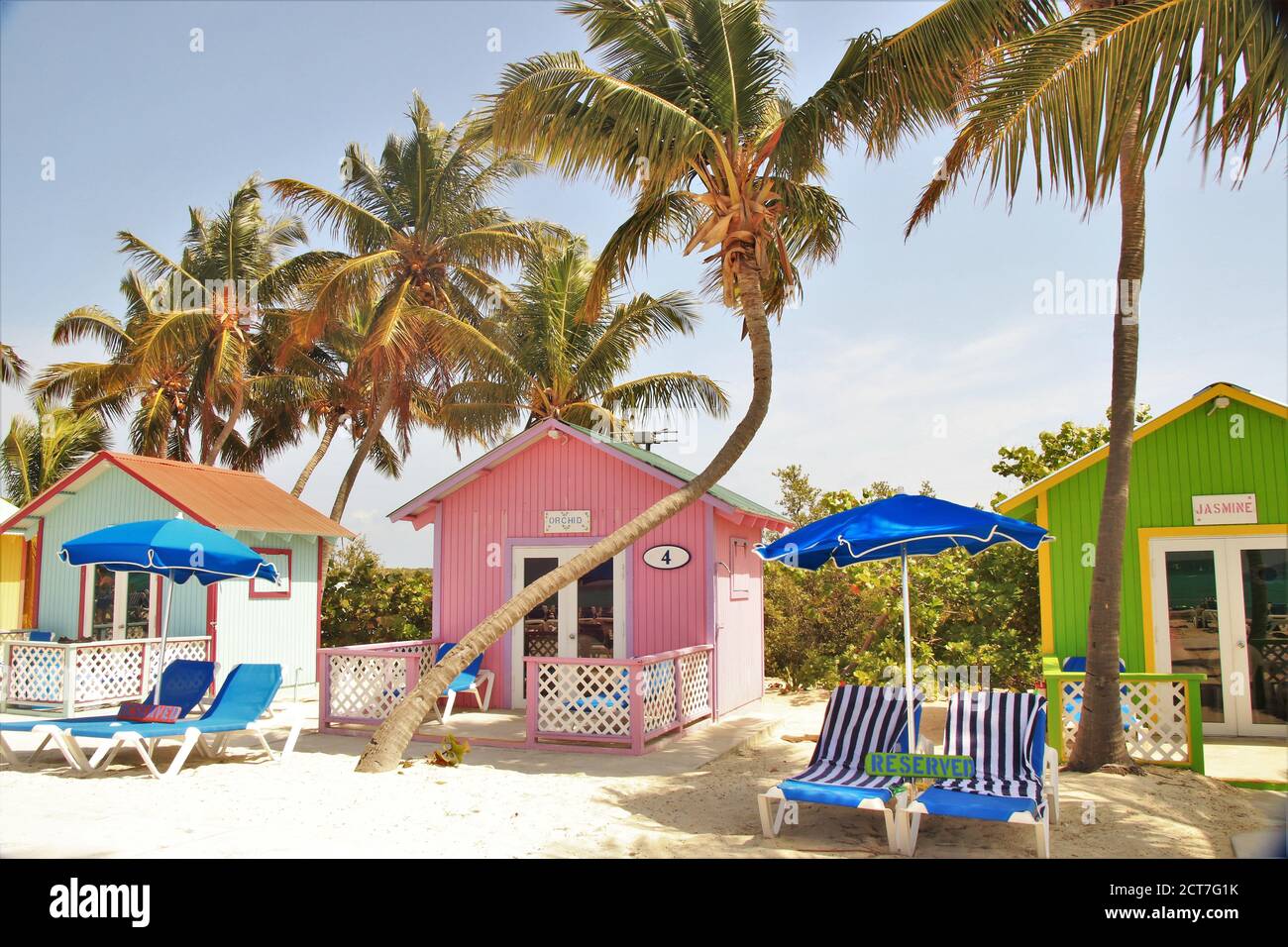 Colorful cabanas and lounge chairs along the beach at Princess Cays in ...
