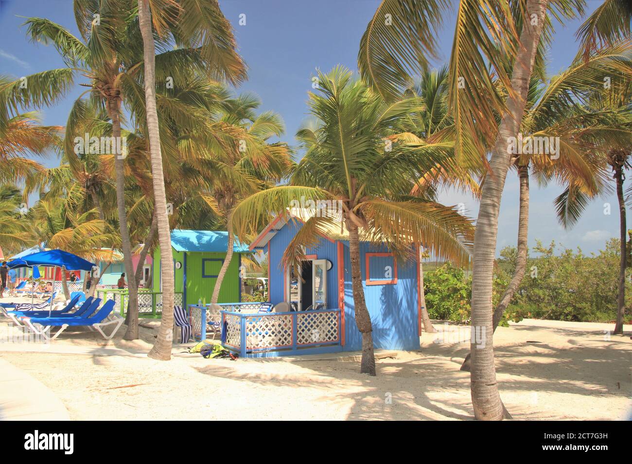 Colorful cabanas and lounge chairs along the beach at Princess Cays in ...