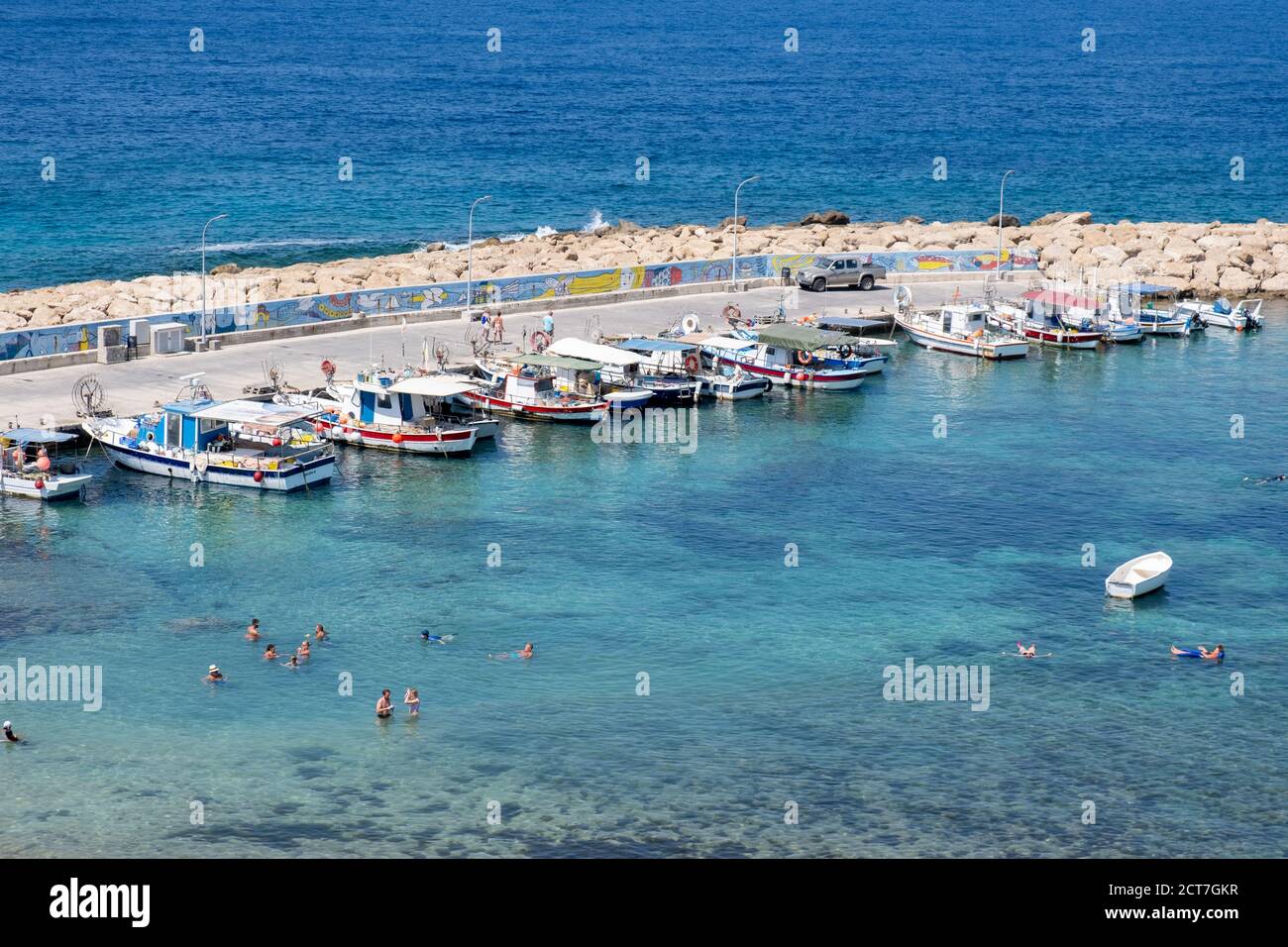Fishing marina with people at the beach and swimming. Akamas Peninsula ...