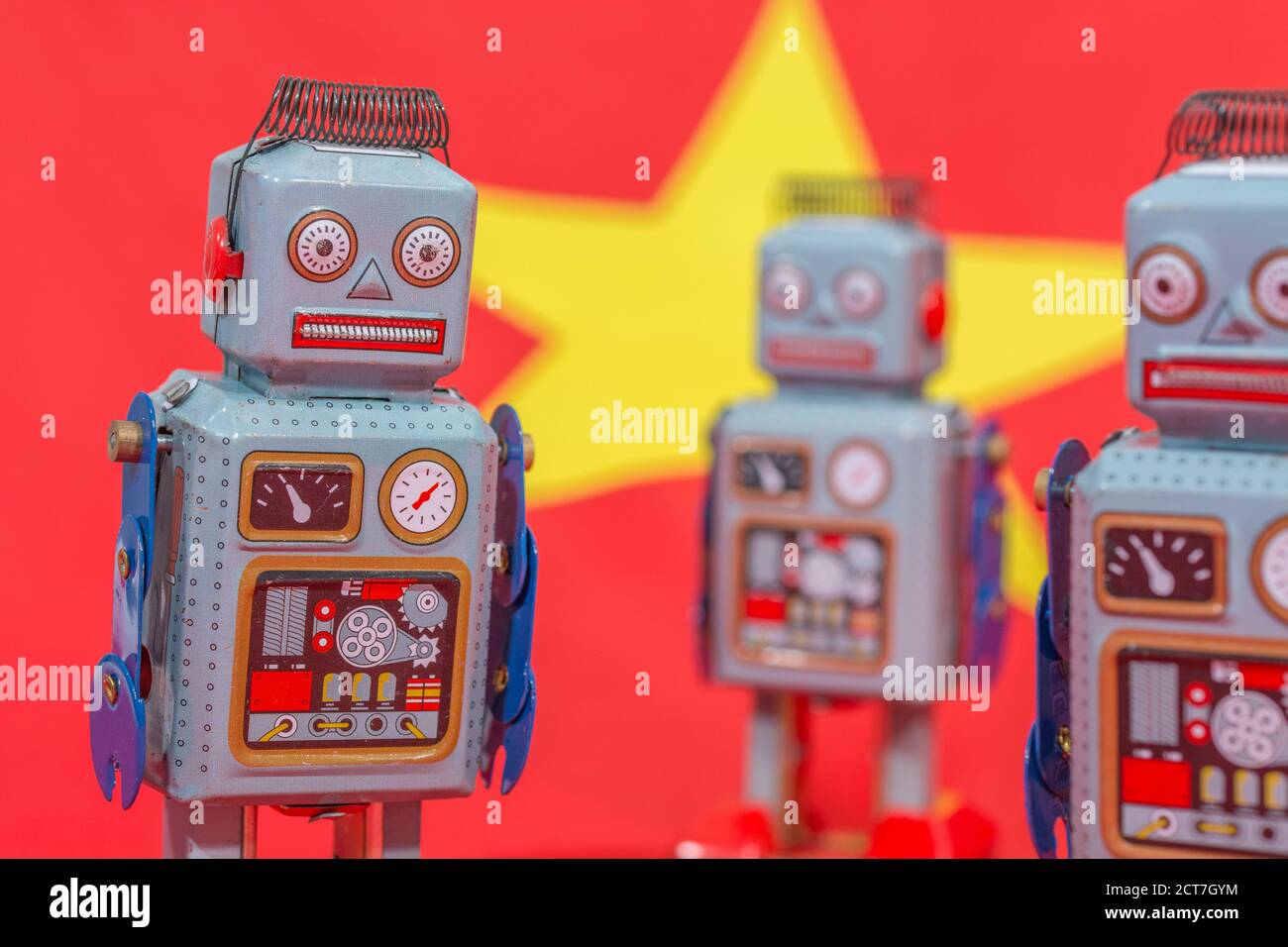 Wind-up clockwork toy robot on Chinese flag b/gd. For Chinese bots ...