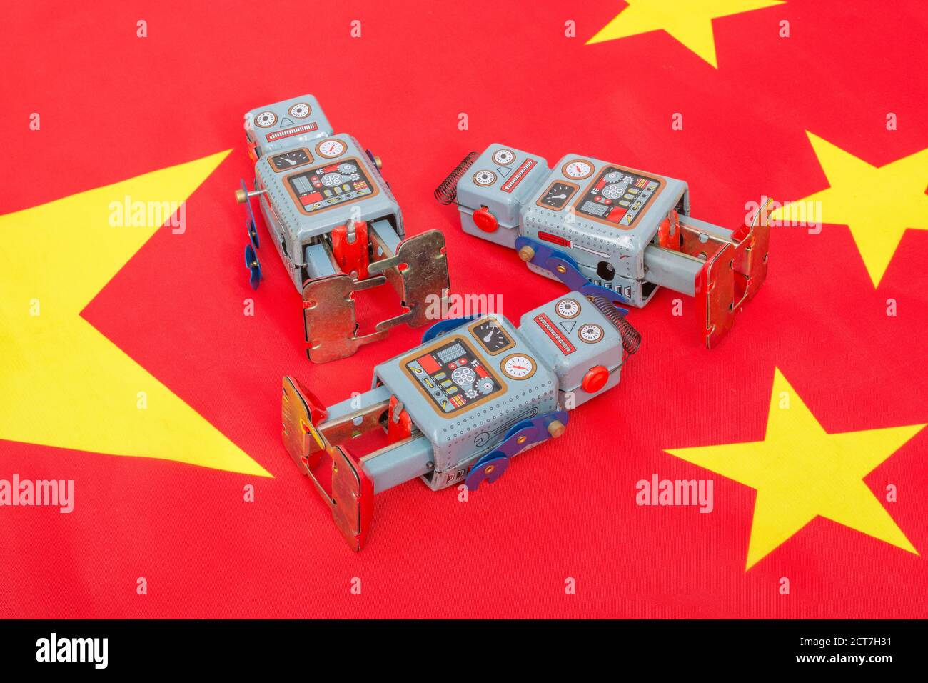 Wind-up clockwork toy robot on Chinese flag b/gd. For Chinese bots ...