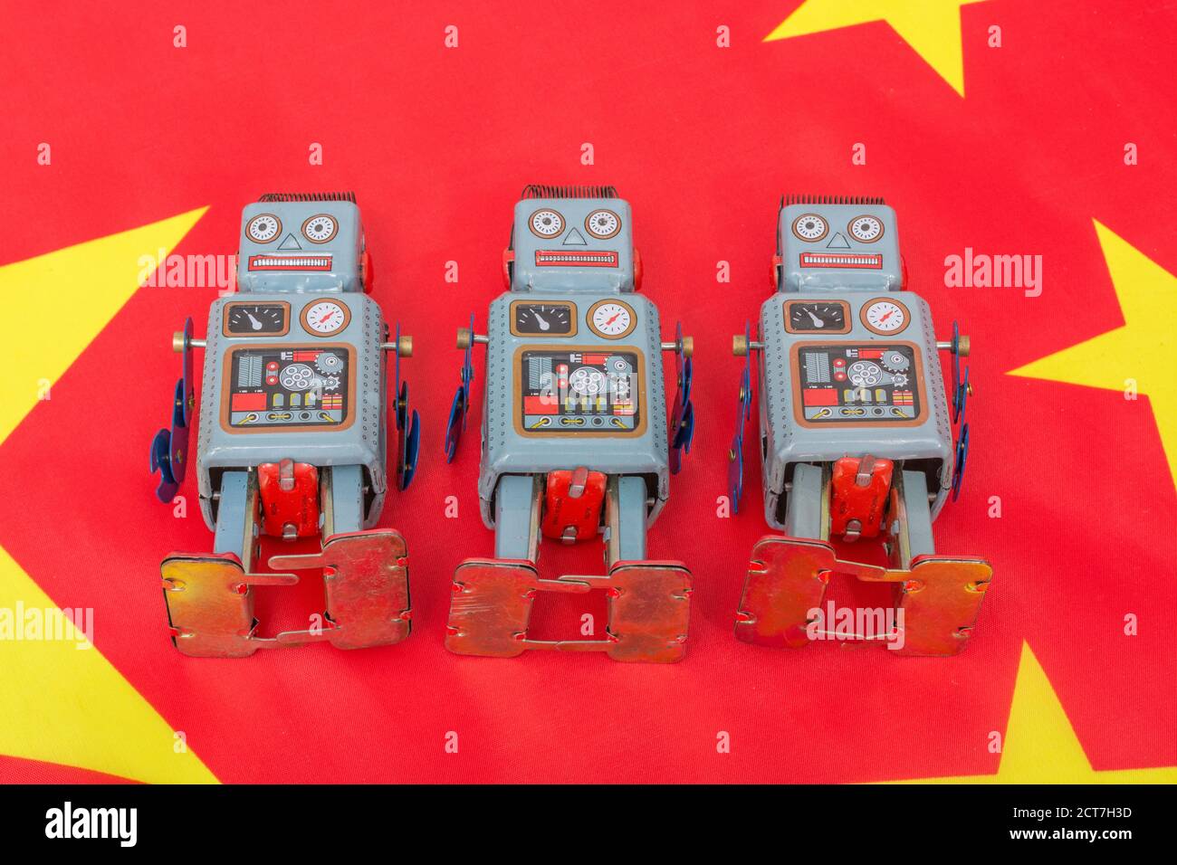 Wind-up clockwork toy robot on Chinese flag b/gd. For Chinese bots ...