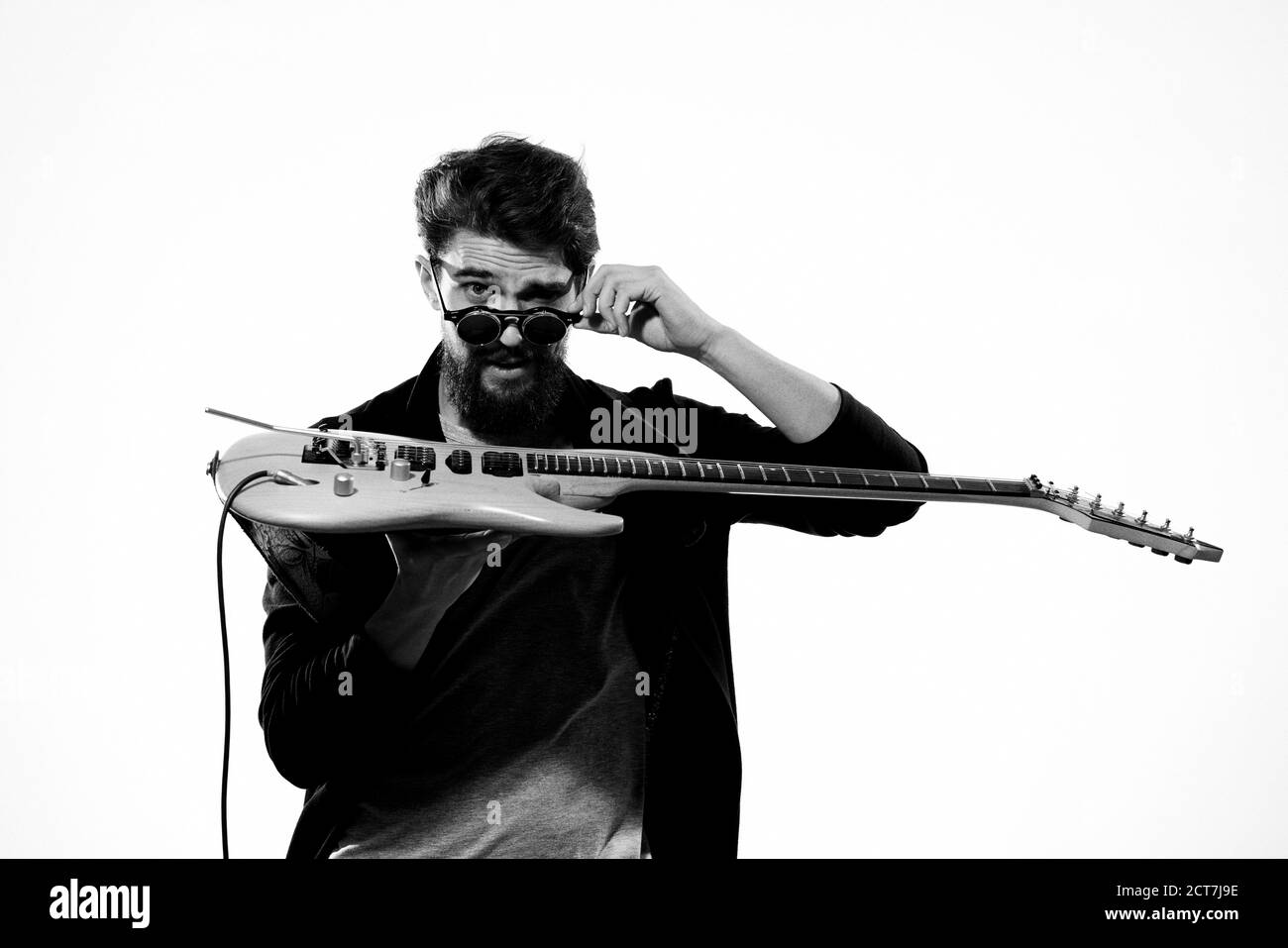 man with guitar in hands musician rock star performance lifestyle light ...