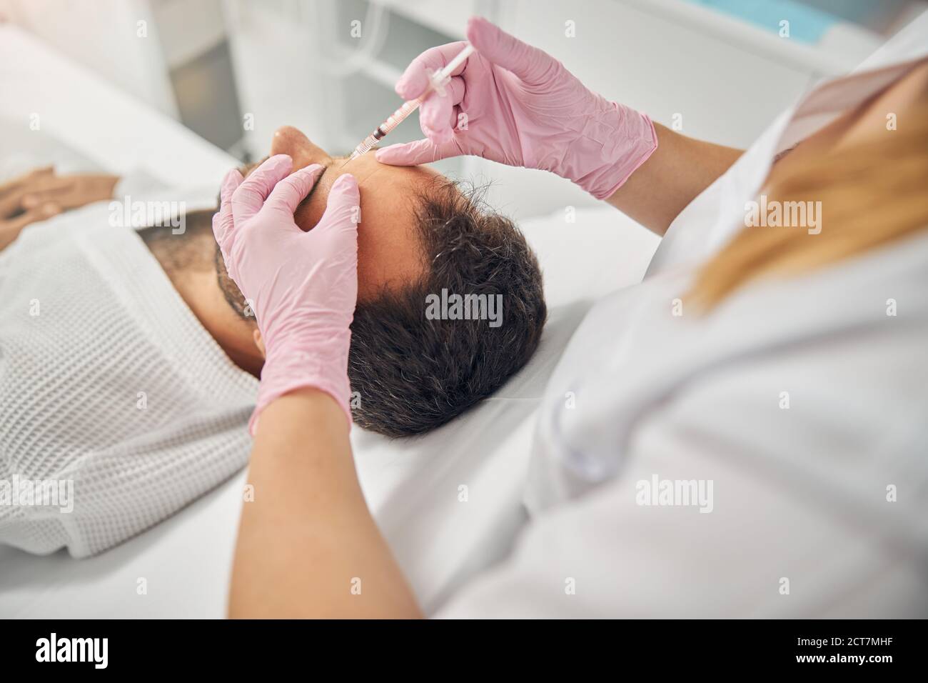 Woman receiving cosmetic injections hi-res stock photography and images ...