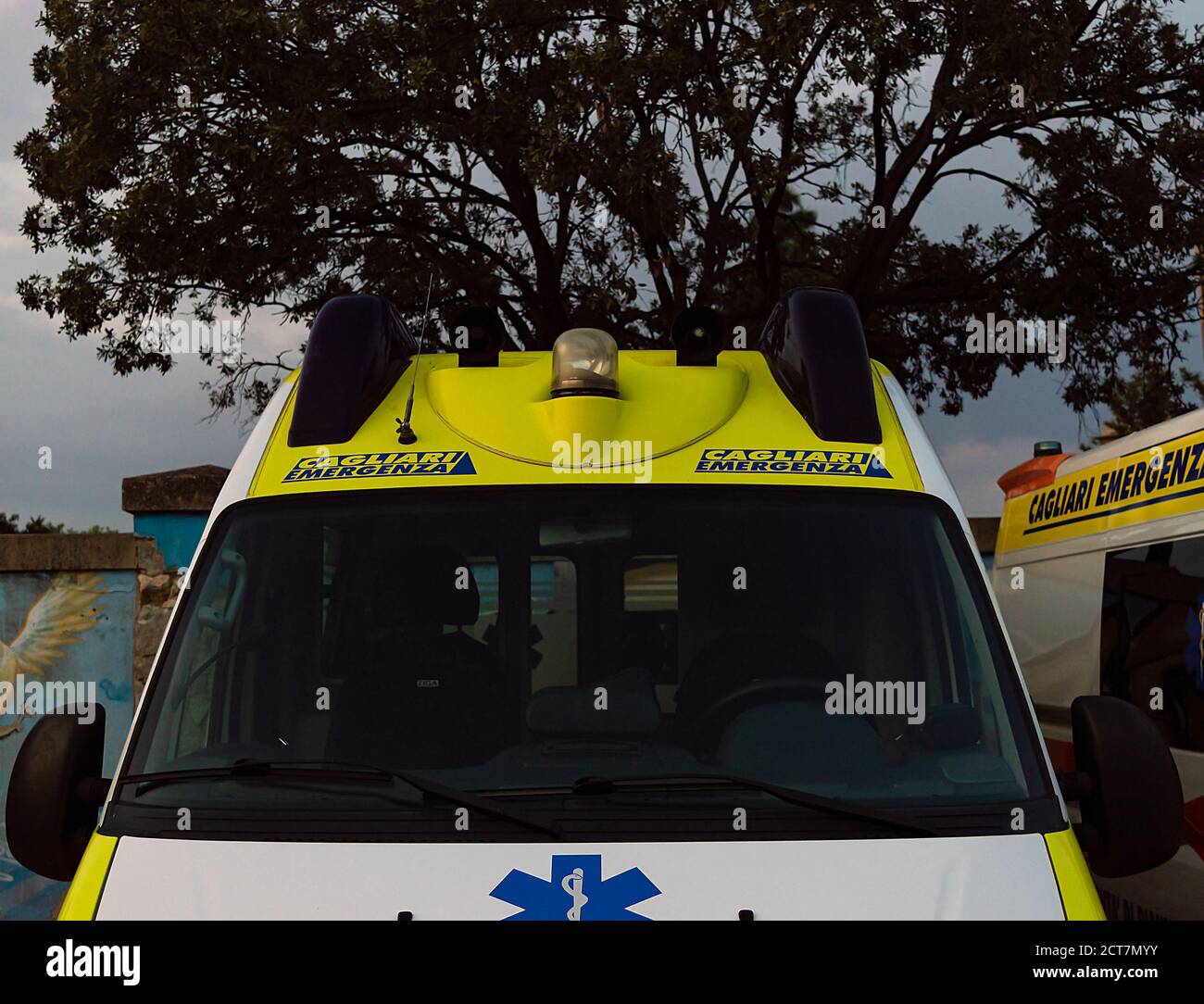 Front view white and yellow ambulance Stock Photo - Alamy