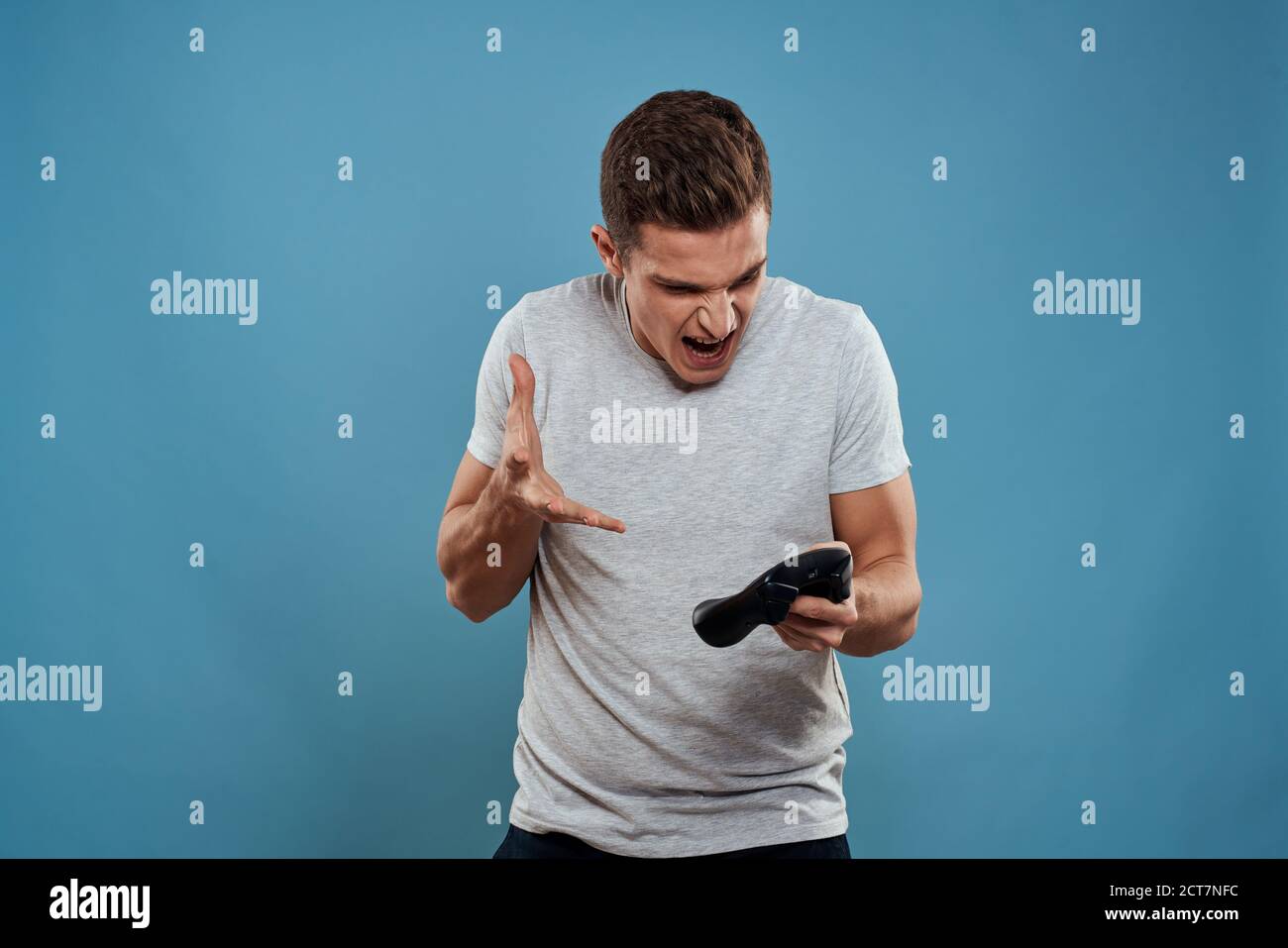 A man with a joystick in his hands entertainment leisure technology ...
