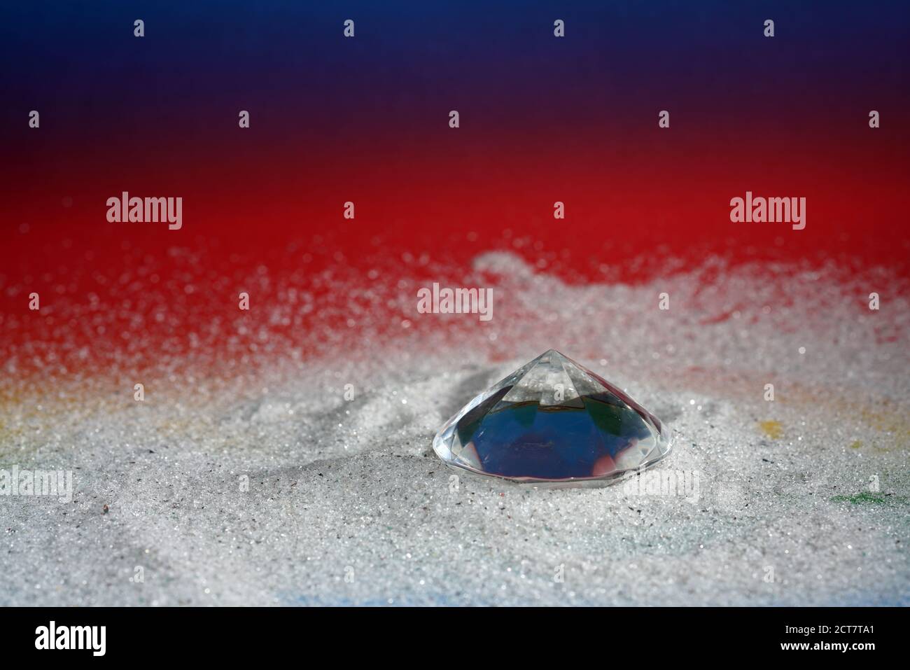 Closeup shot of a diamond in the sand Stock Photo - Alamy