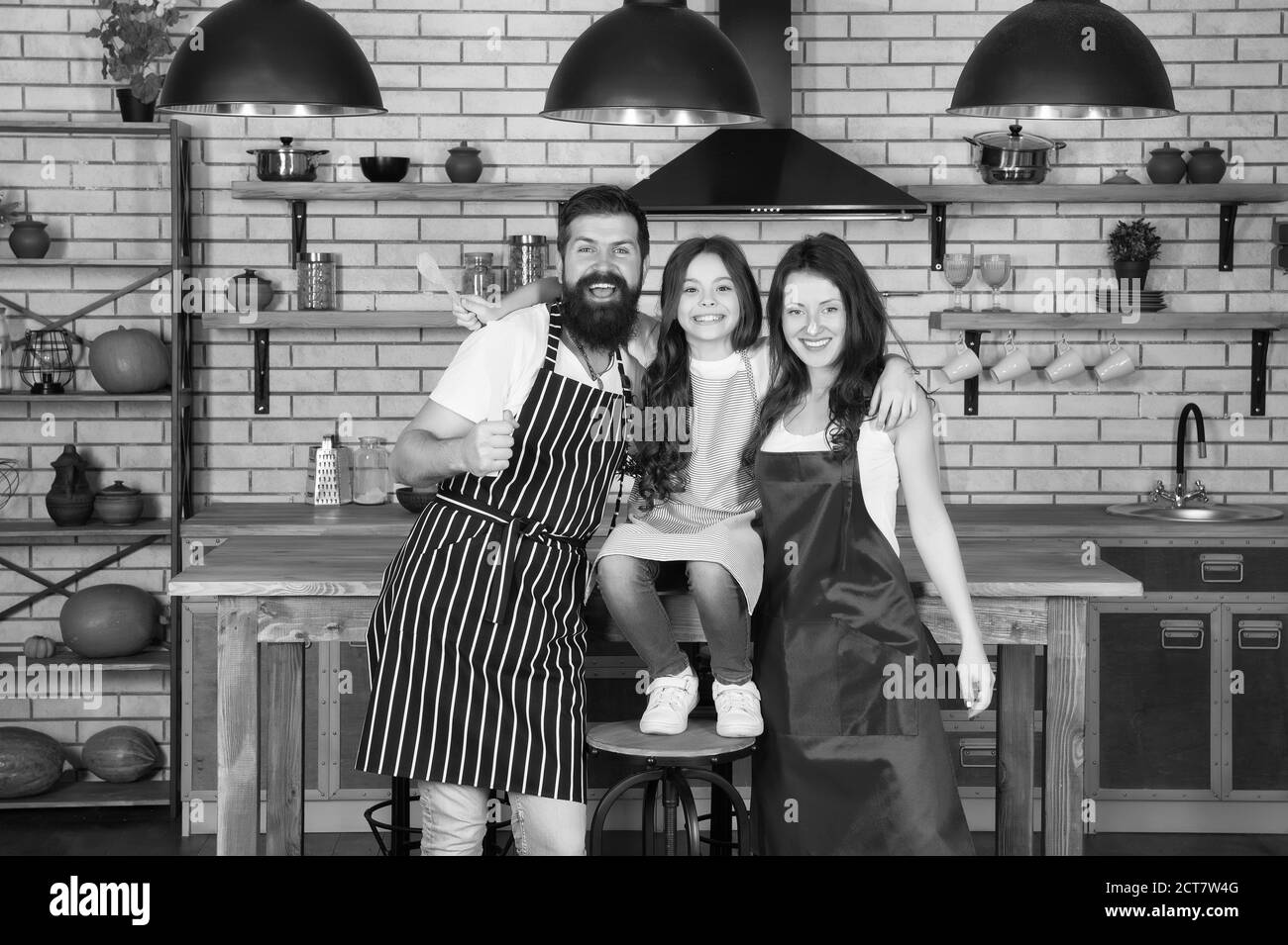 Family holidays. Mother father and daughter cooking together. Happy ...