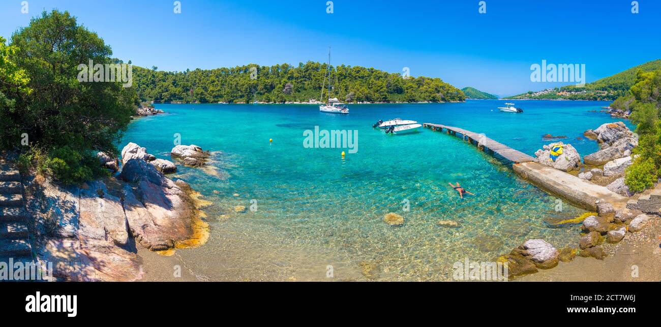 Gialia beach with old windmill in Alonnisos island, Greece Stock Photo ...