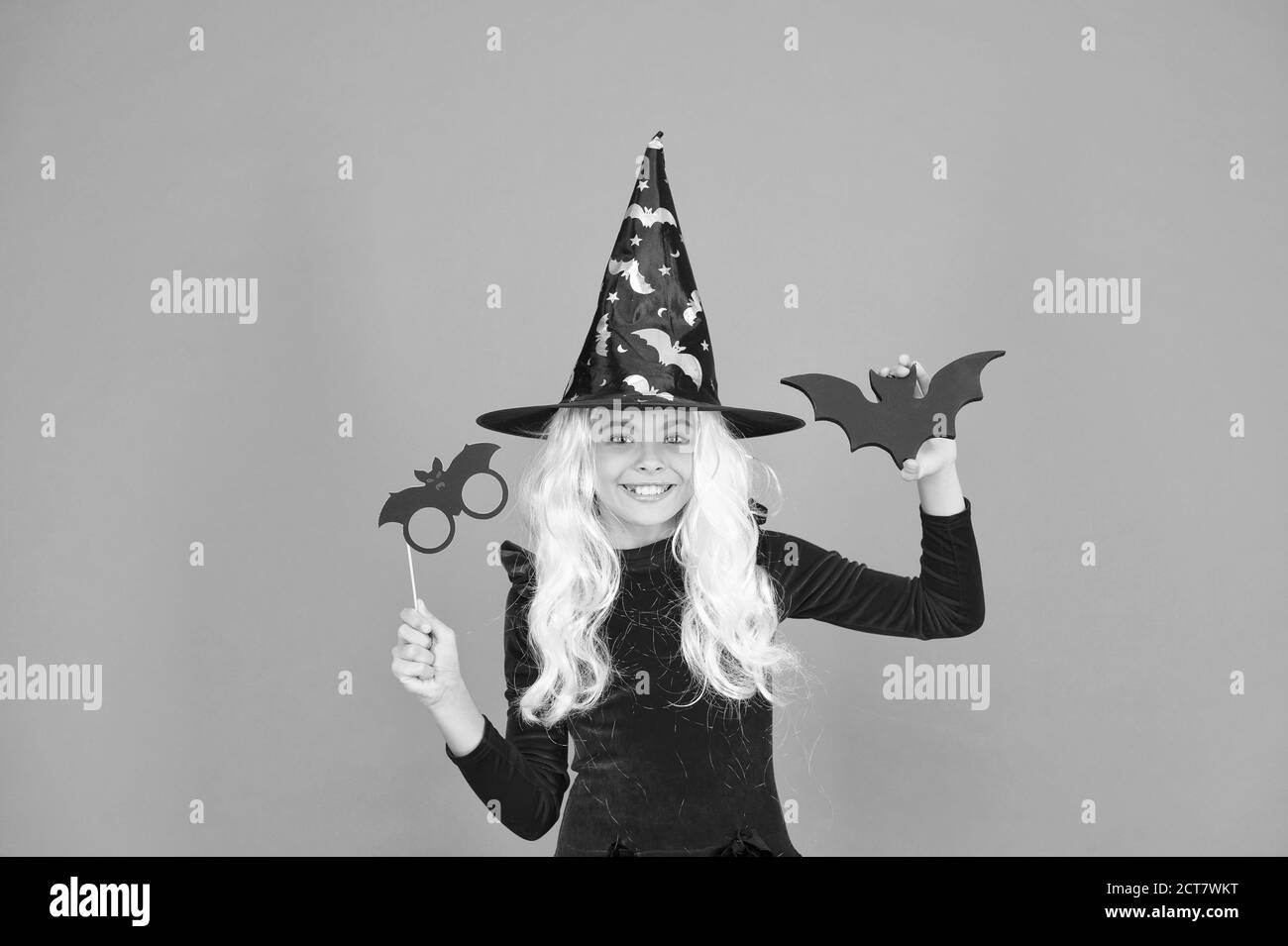 Curse spell. Little girl cast magic spell orange background. Wicked ...