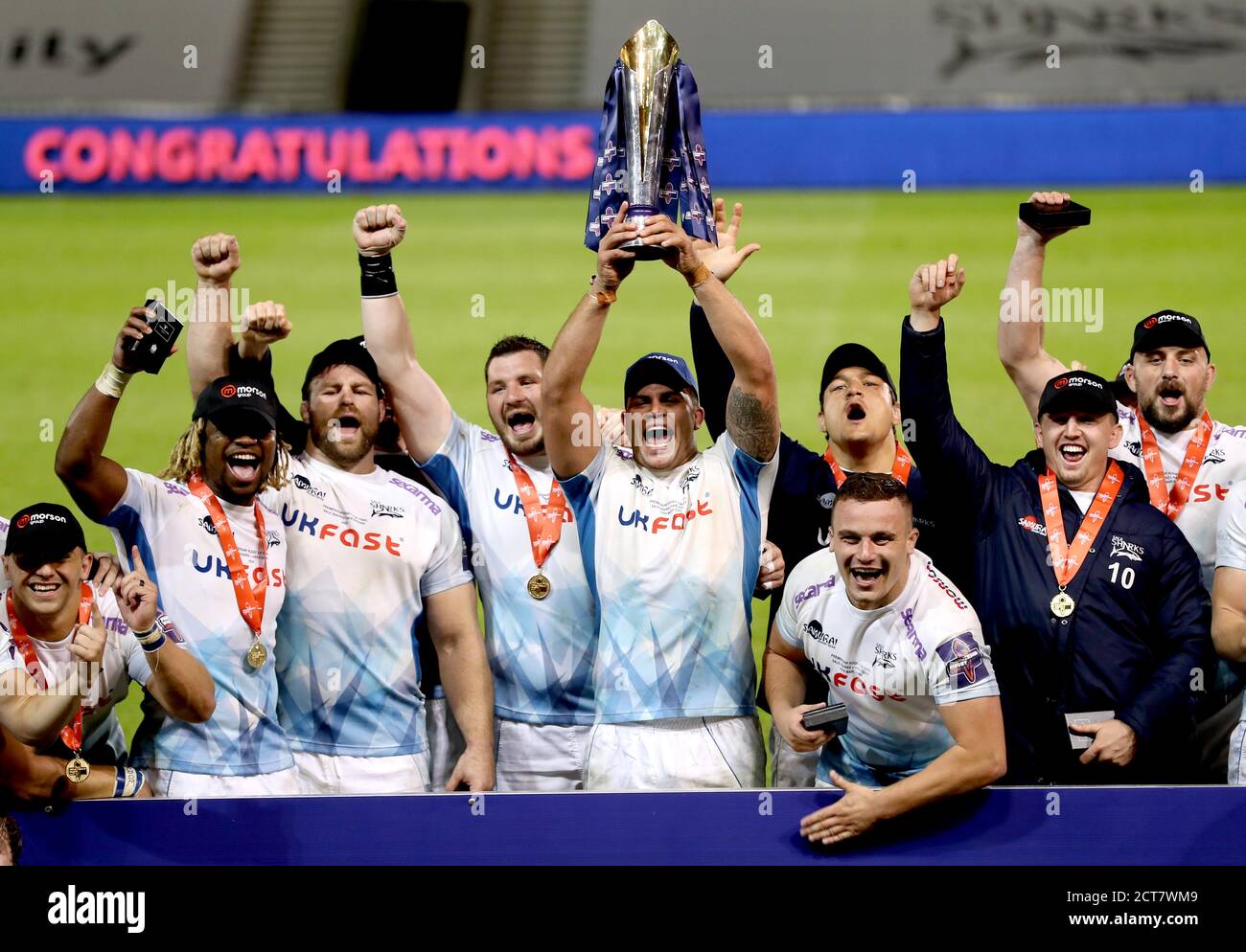 Sale Sharks' Jono Ross (centre) lifts the trophy as he celebrates with ...