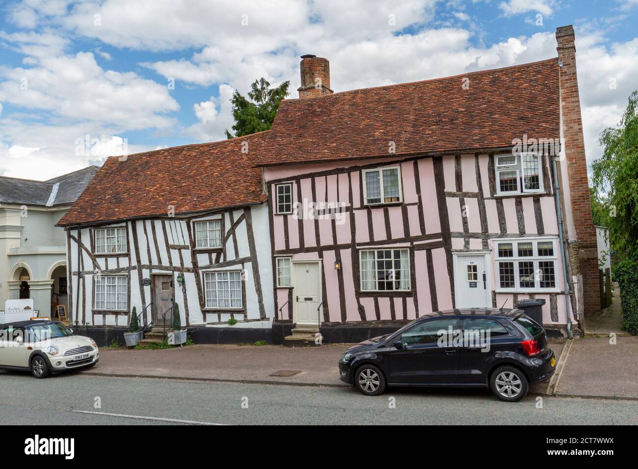 Crooked timber framed and plaster cottages in Lavenham, Suffolk, UK ...