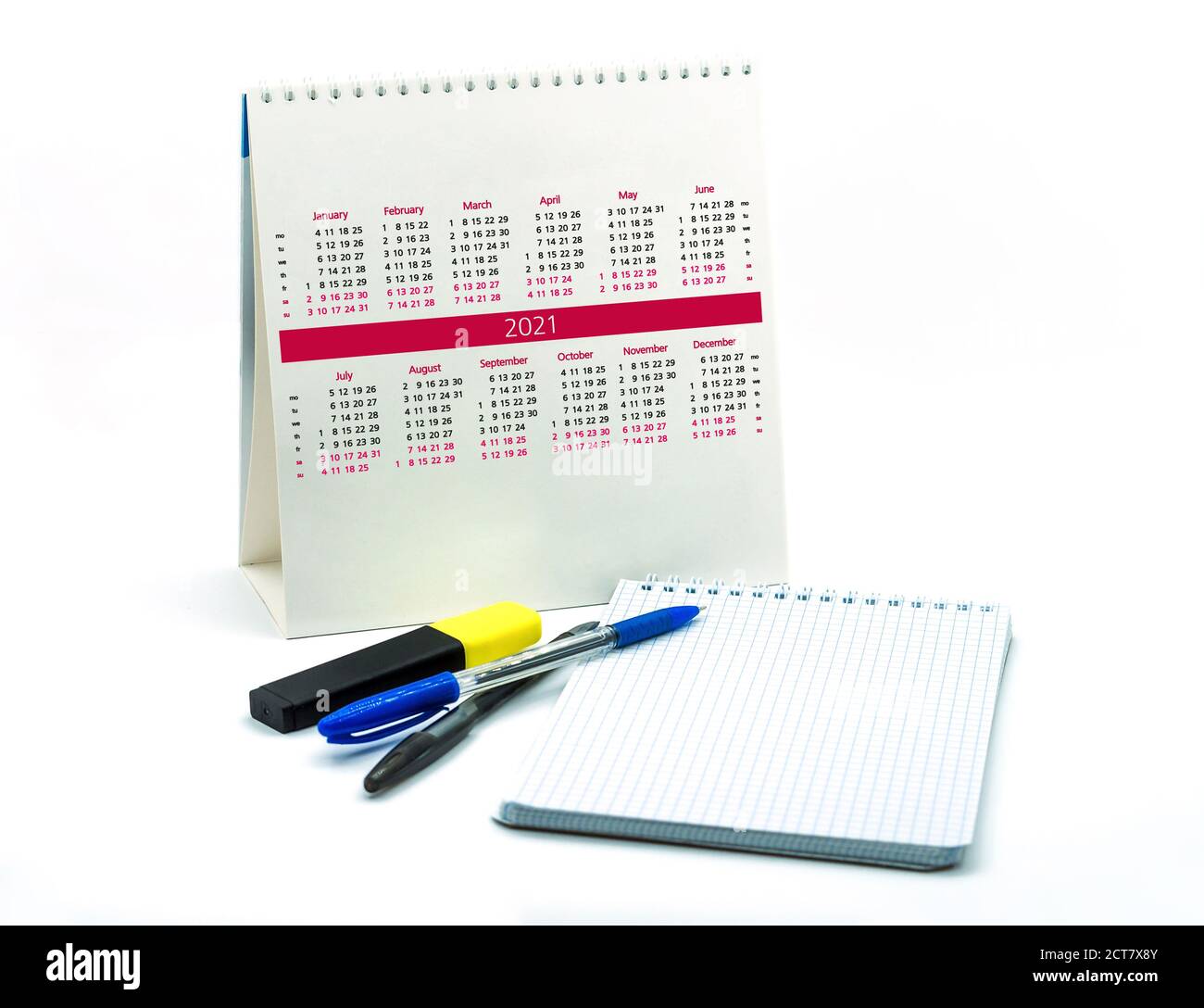 Notepad and calendar 2021, two pens and a marker with a Notepad on a ...