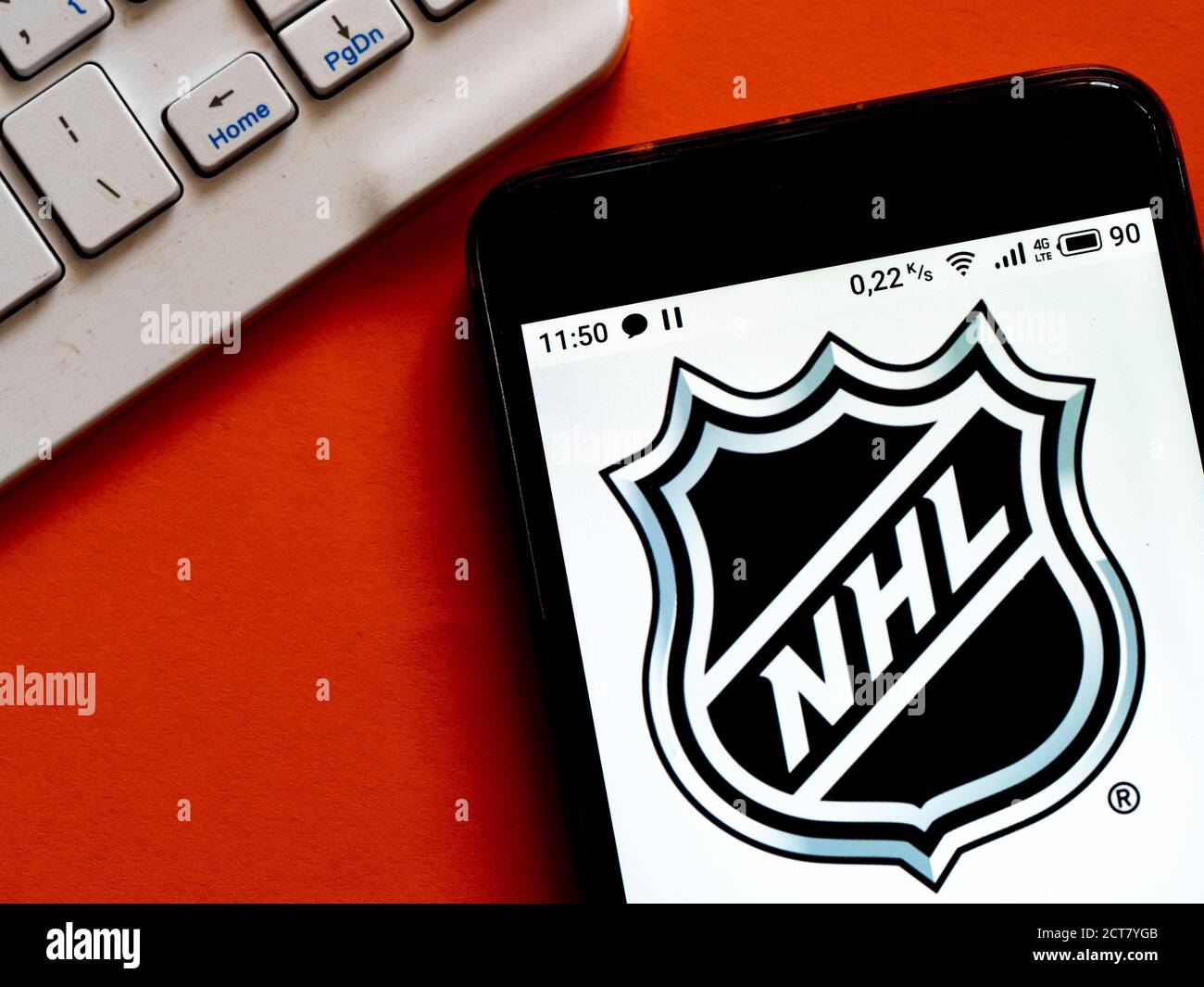 In this photo illustration an NHL logo seen displayed on a smartphone ...