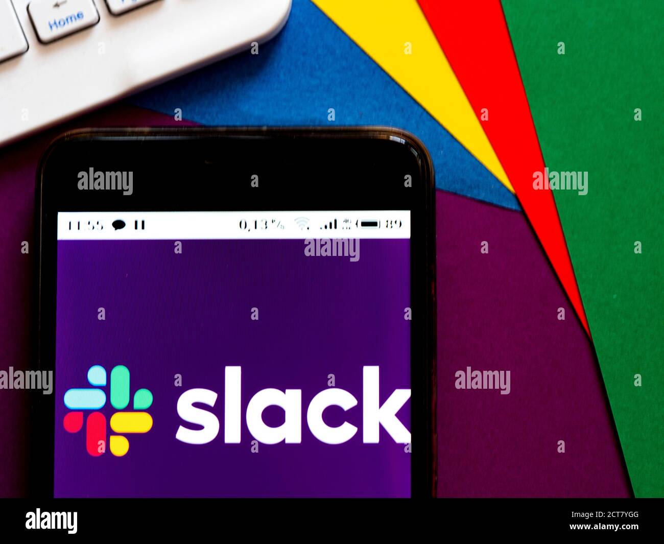 In this photo illustration a Slack logo seen displayed on a smartphone ...
