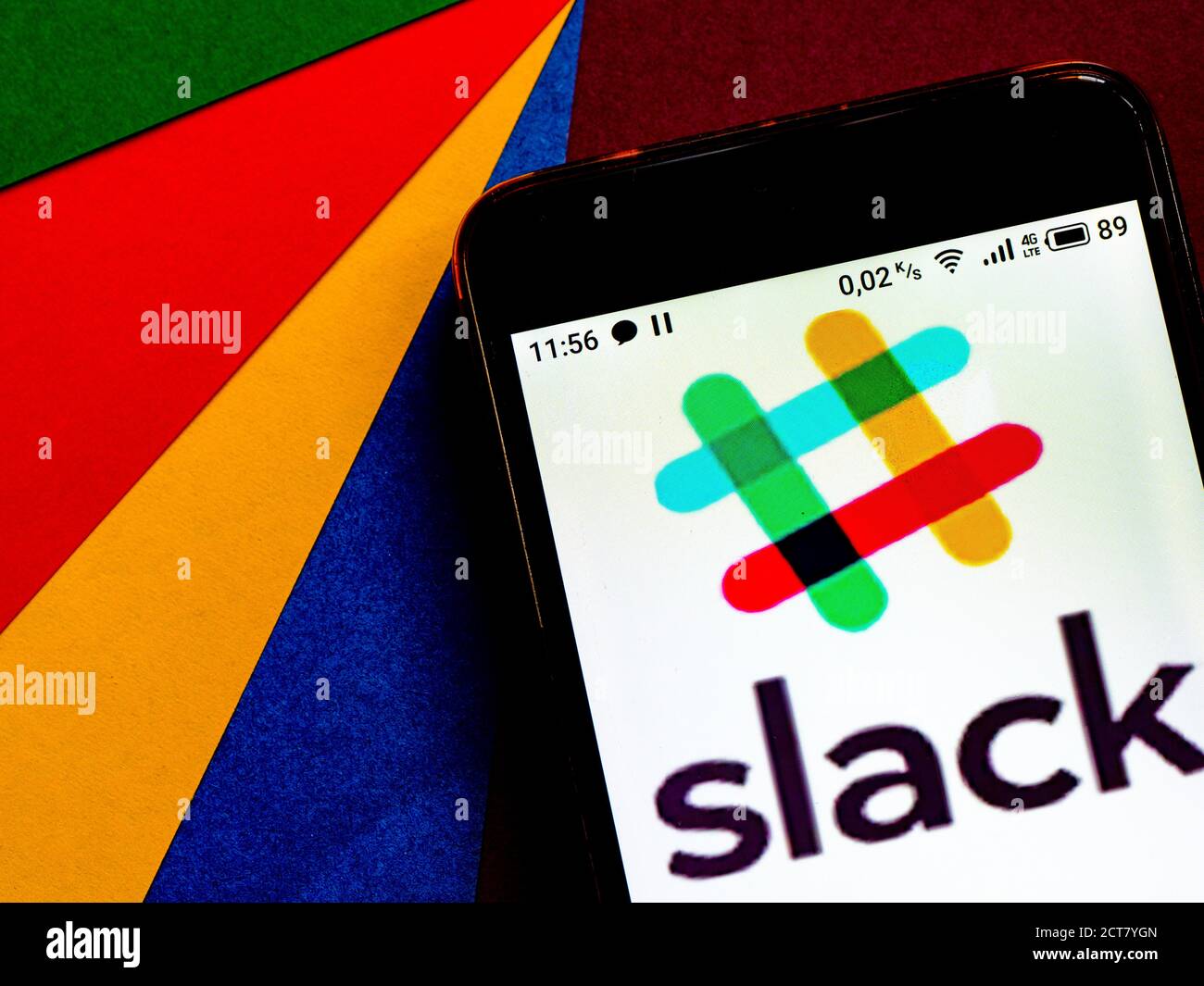 In this photo illustration a Slack logo seen displayed on a smartphone ...