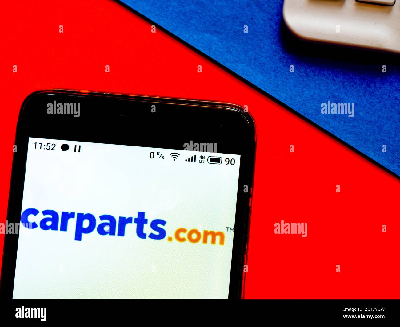In this photo illustration a CarParts.com logo seen displayed on a ...