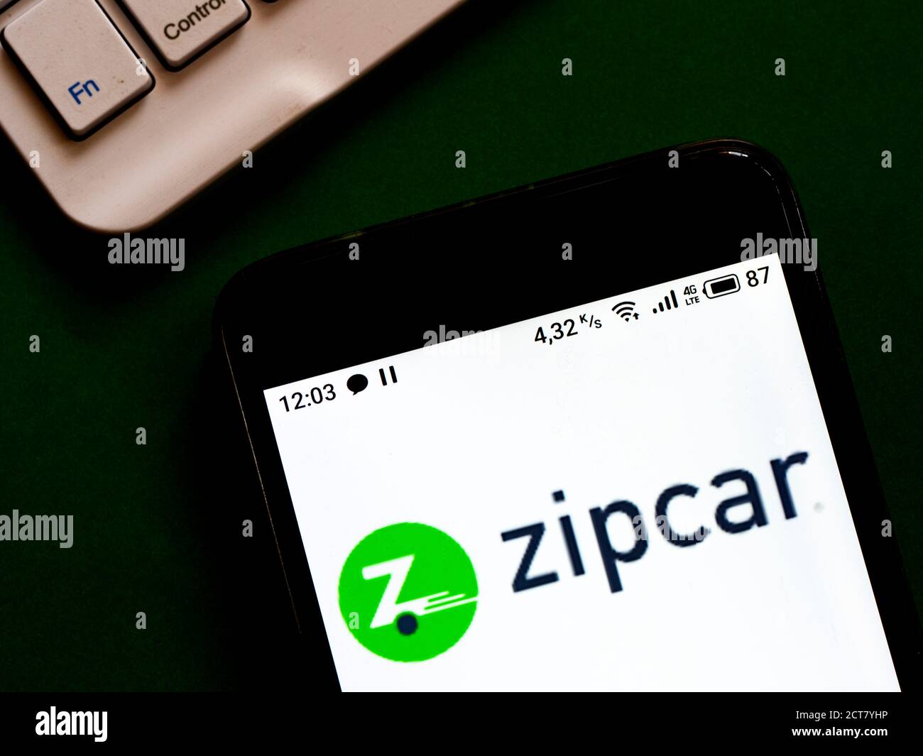 In this photo illustration a Zipcar logo seen displayed on a smartphone ...