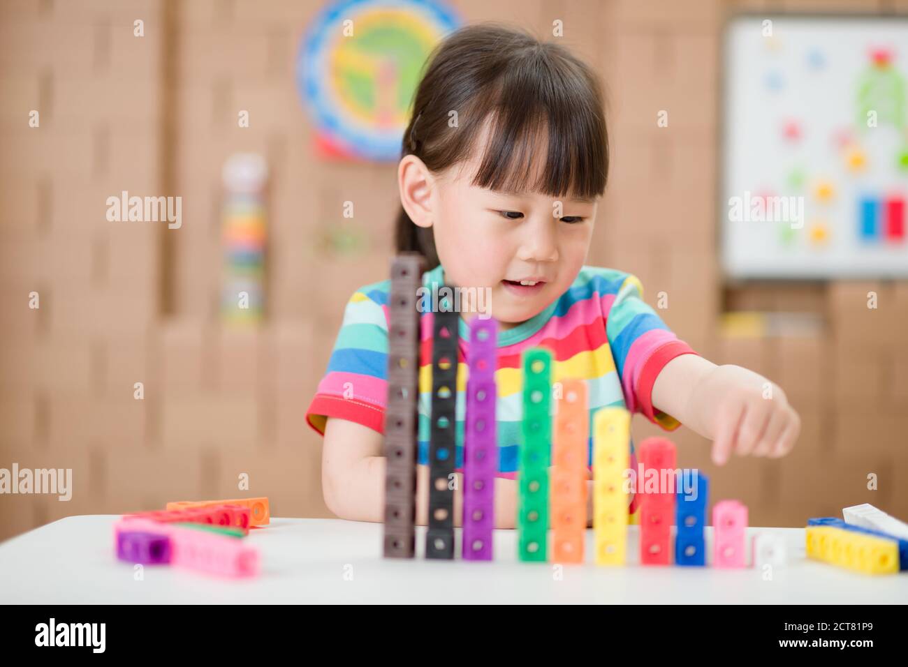 young girl play number sticks for homeschooling Stock Photo - Alamy