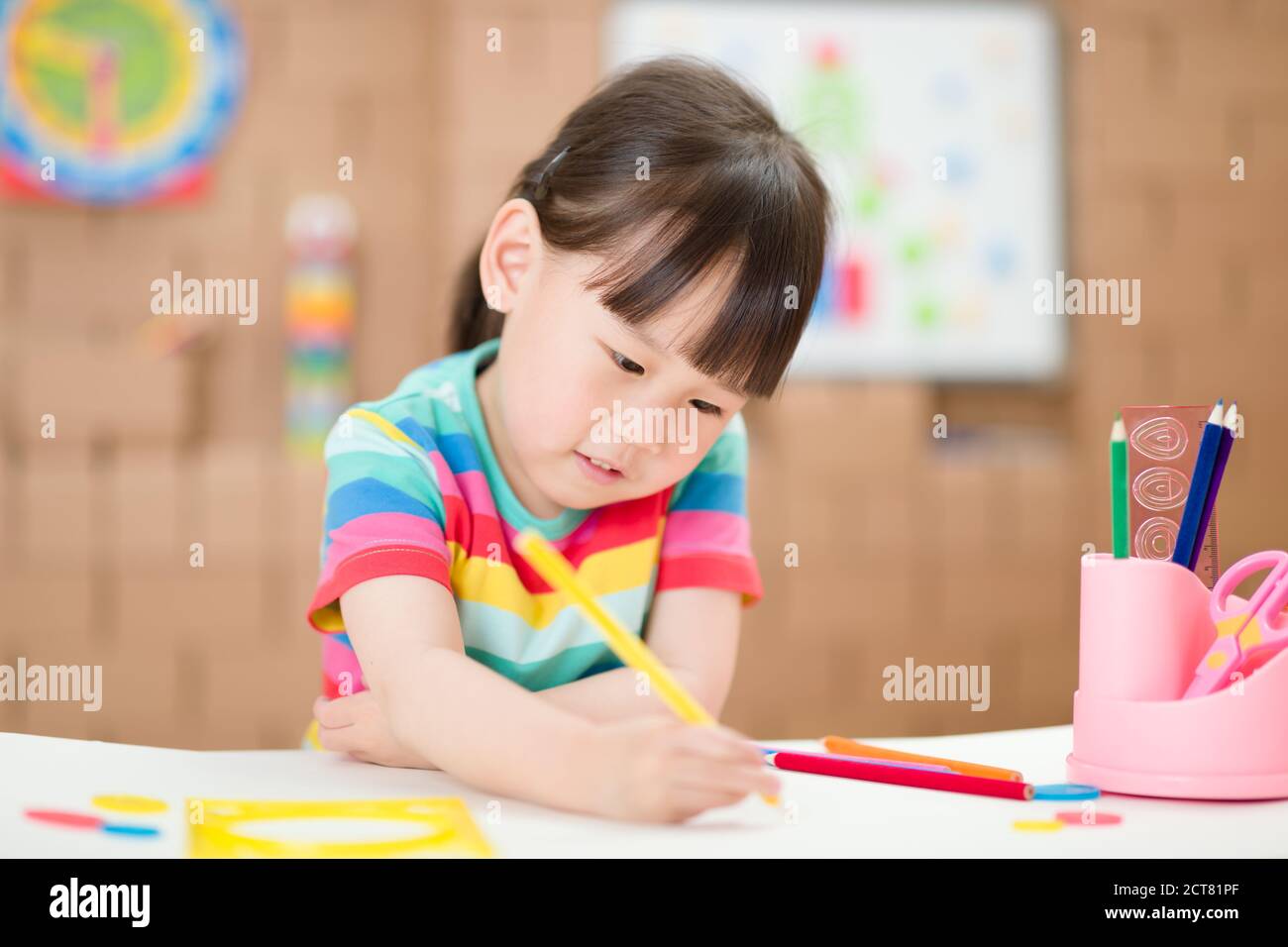 young girl practice drawing different shapes for homeschooling Stock ...