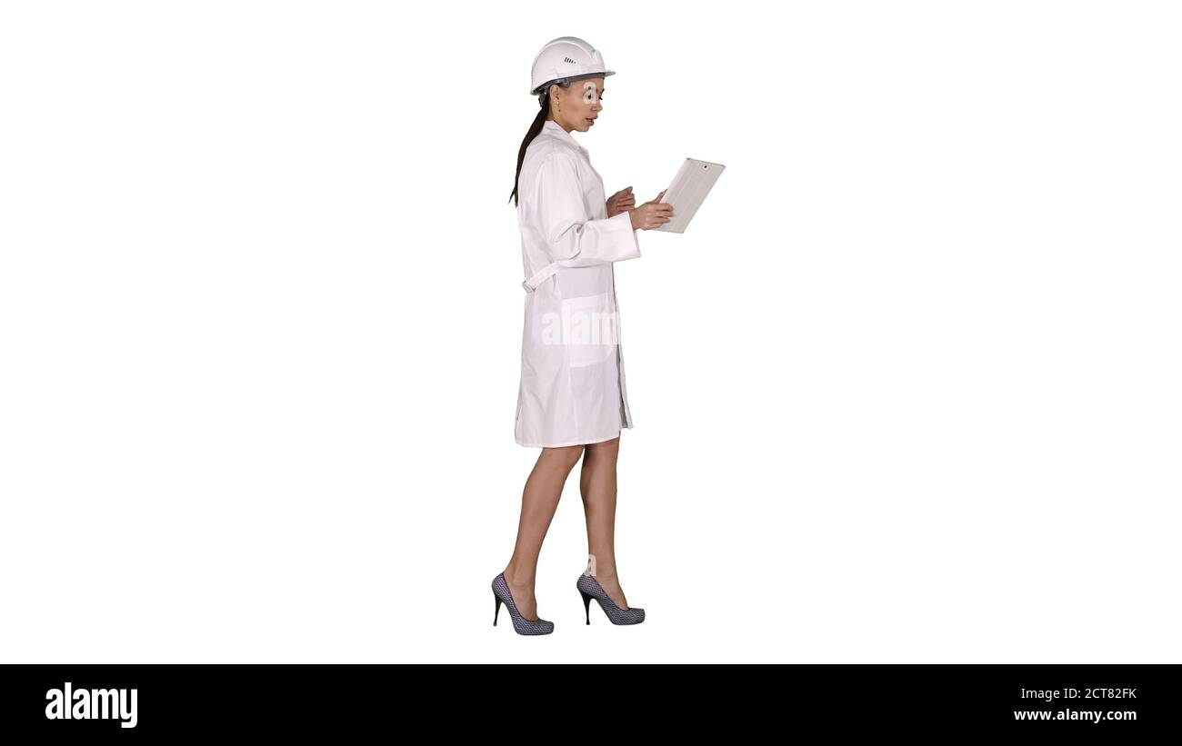 Woman engineer with tablet making video call on white background Stock ...