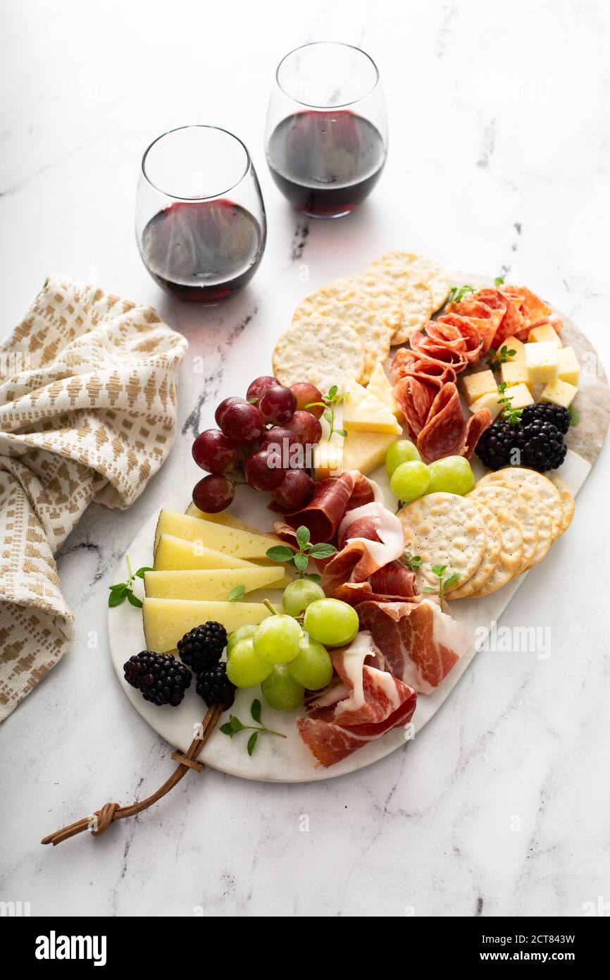 Charcuterie board with cheese and meat Stock Photo - Alamy