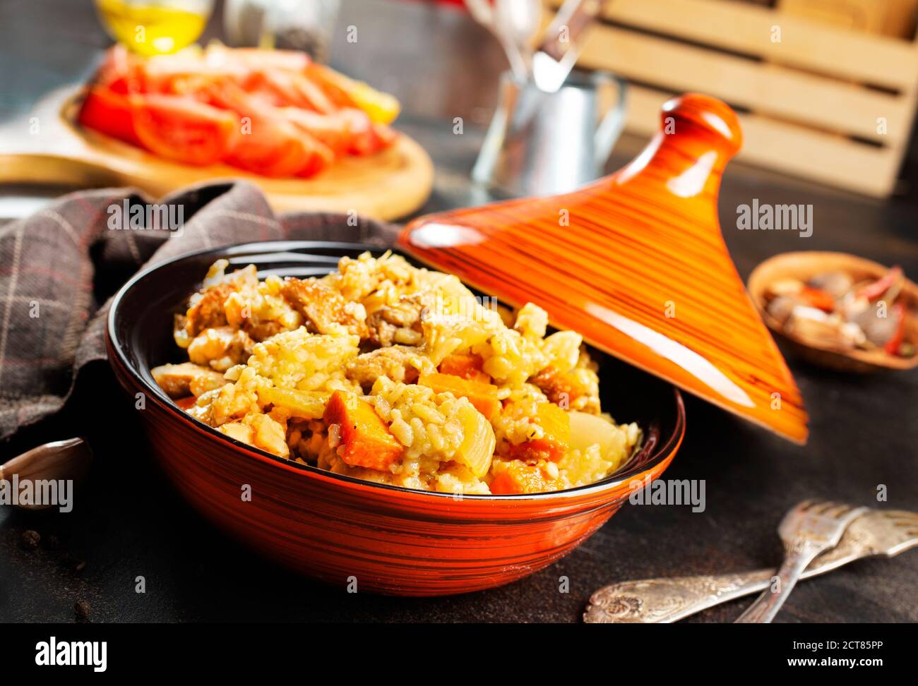 Tagine with traditional uzbek pilaf. rice with meat Stock Photo - Alamy