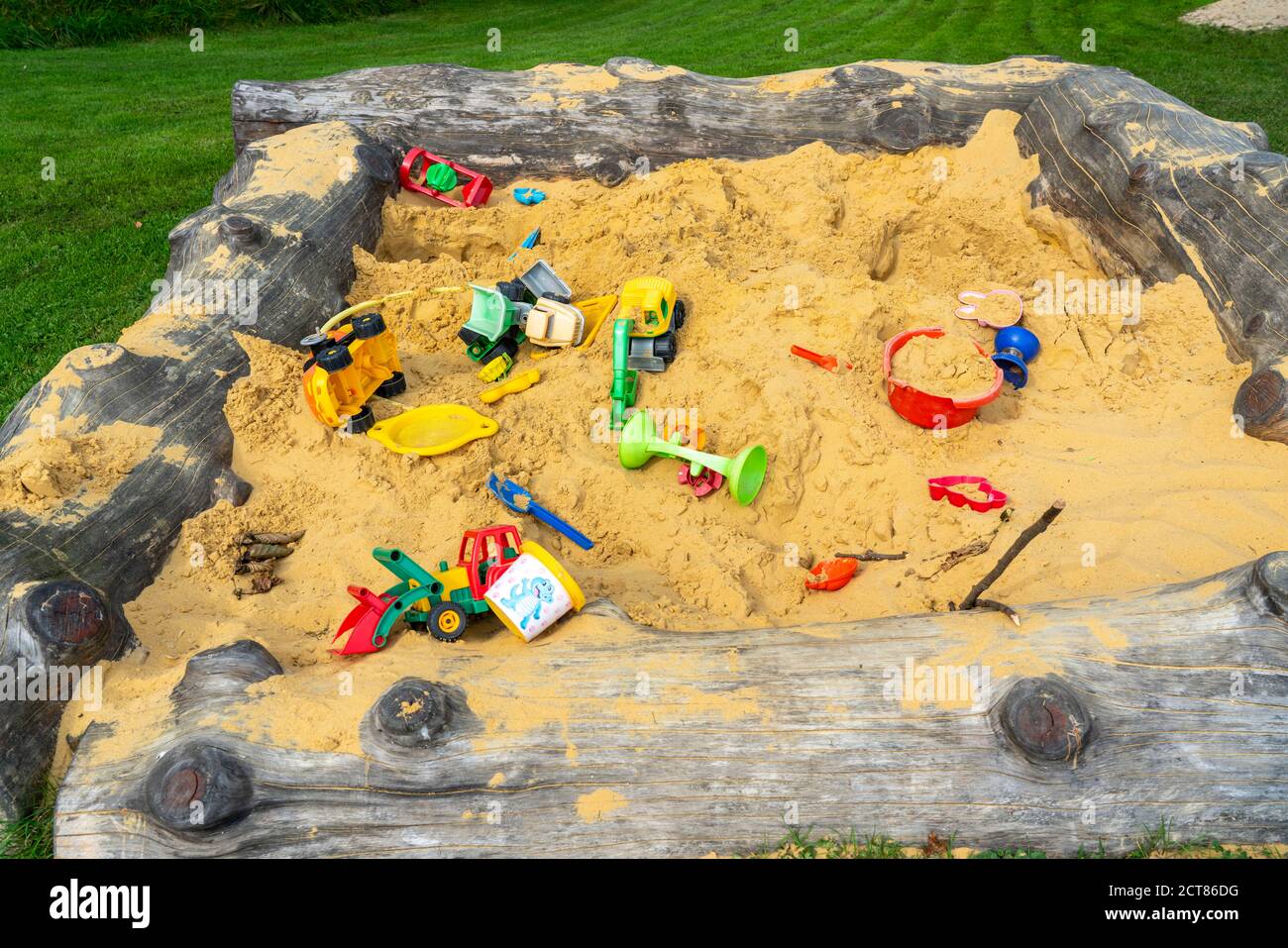 Sandpit, on a children's playground, sandpit with various toys made of ...