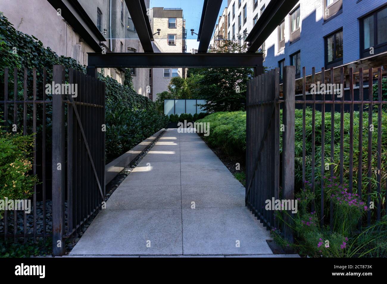 An entrance through gate into an apartment building in Manhattan, NYC ...