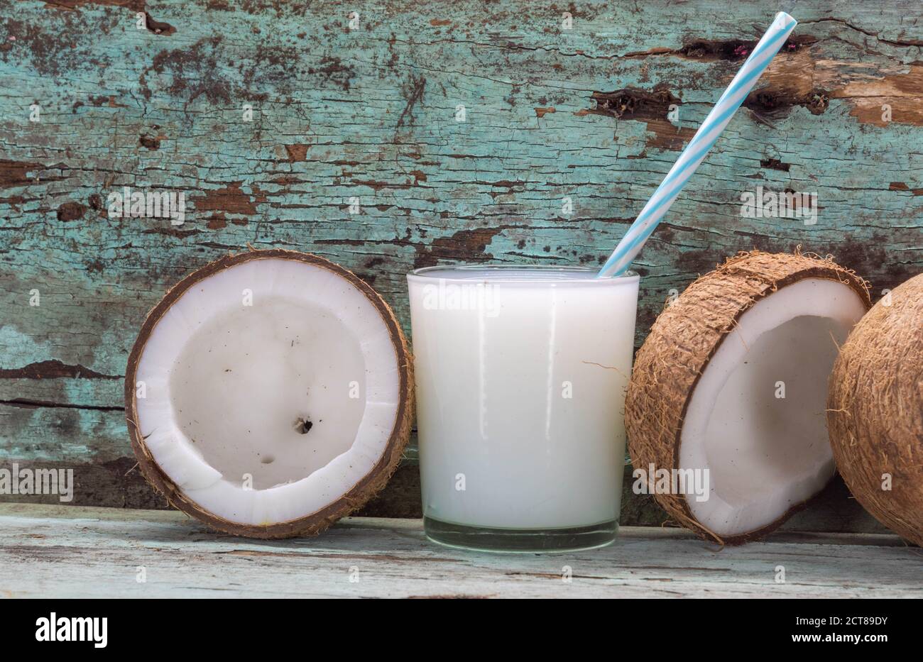 Glass of fresh coconut milk. It is rich in good saturated fat, which is ...
