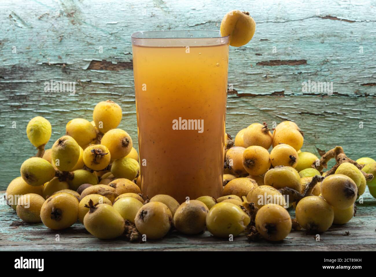 Yellow loquat juice. Refreshing drink and detox. Natural food. Exotic ...