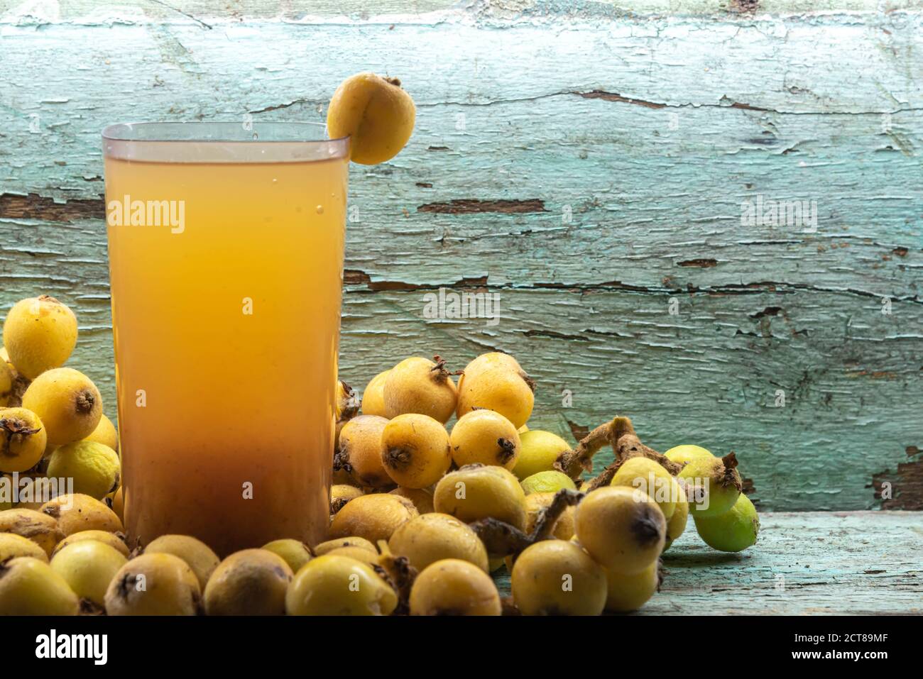 Yellow loquat juice. Refreshing drink and detox. Natural food. Exotic ...