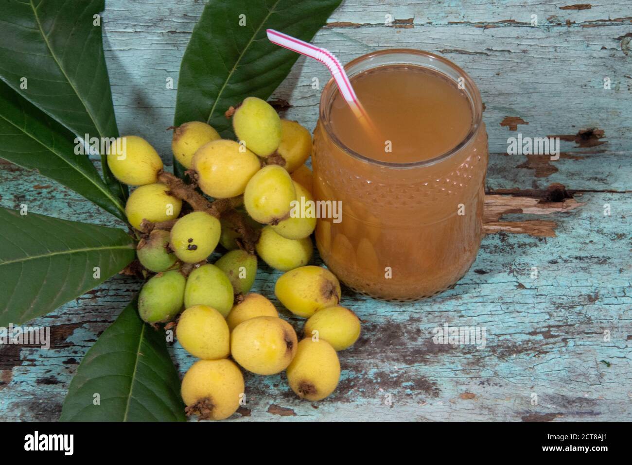 Yellow medlar fruit juice (Eriobotrya japonica). Plant of the botanical ...