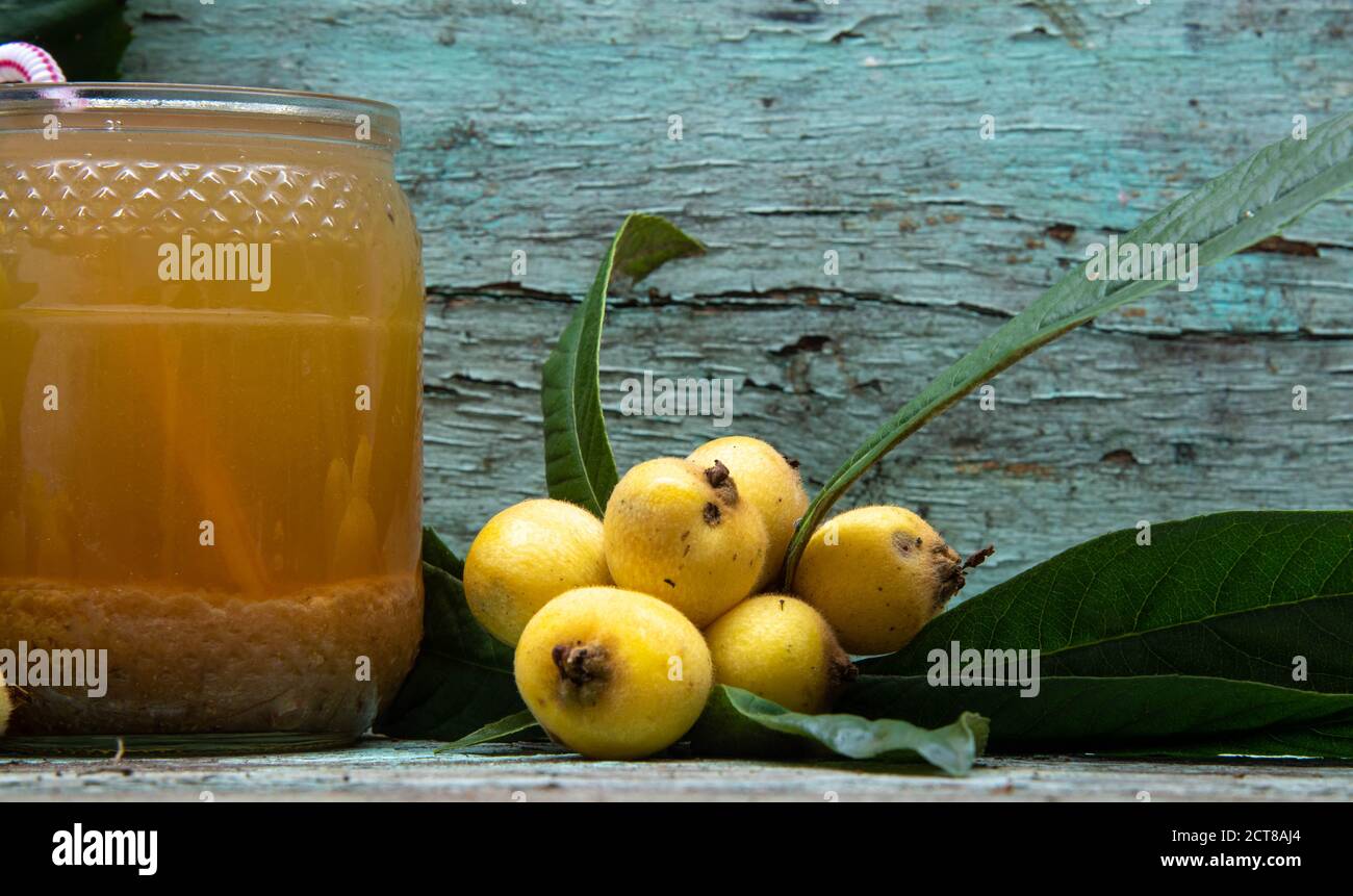 Yellow medlar fruit juice (Eriobotrya japonica). Plant of the botanical ...