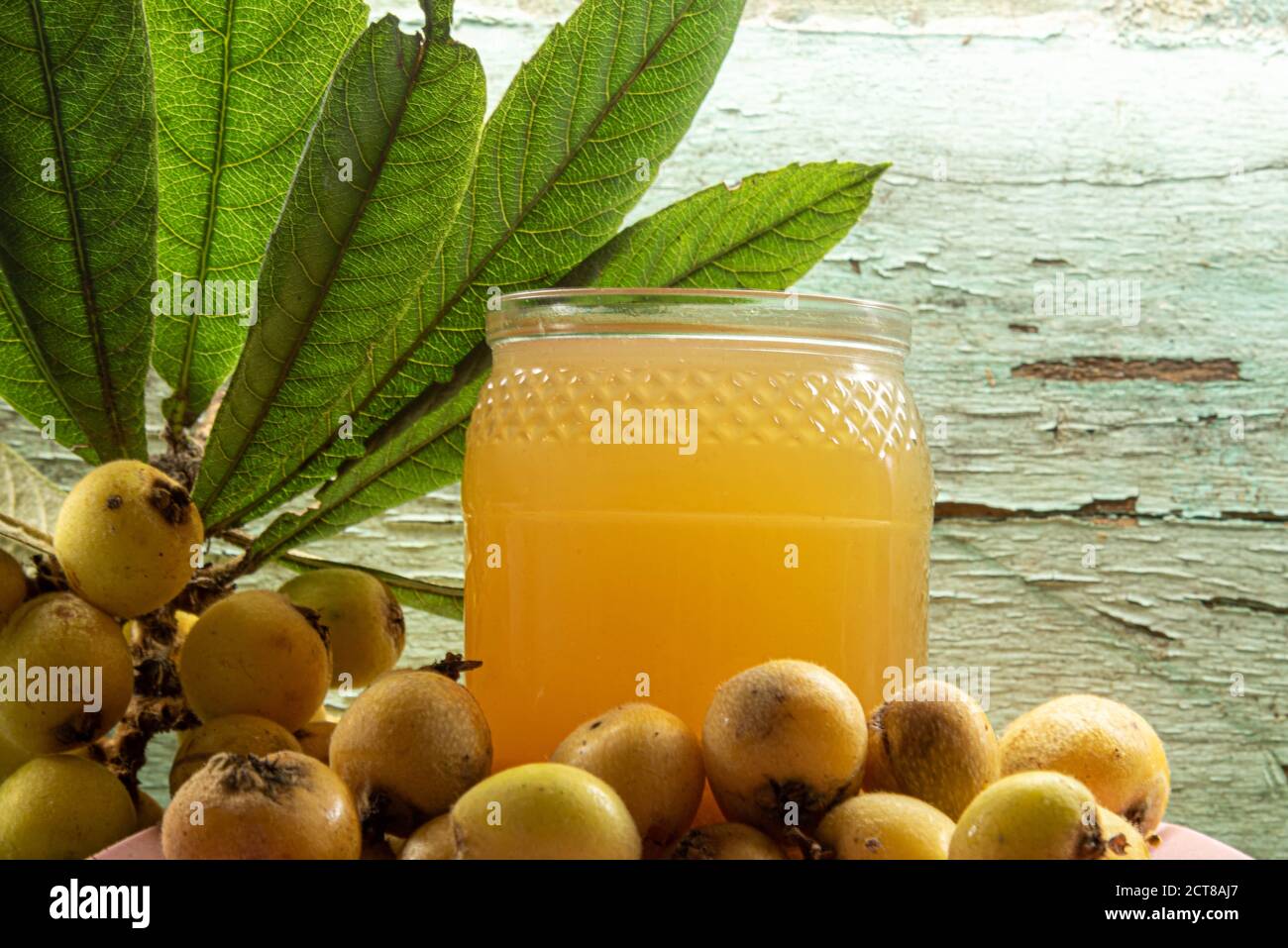 Yellow medlar fruit juice (Eriobotrya japonica). Plant of the botanical ...
