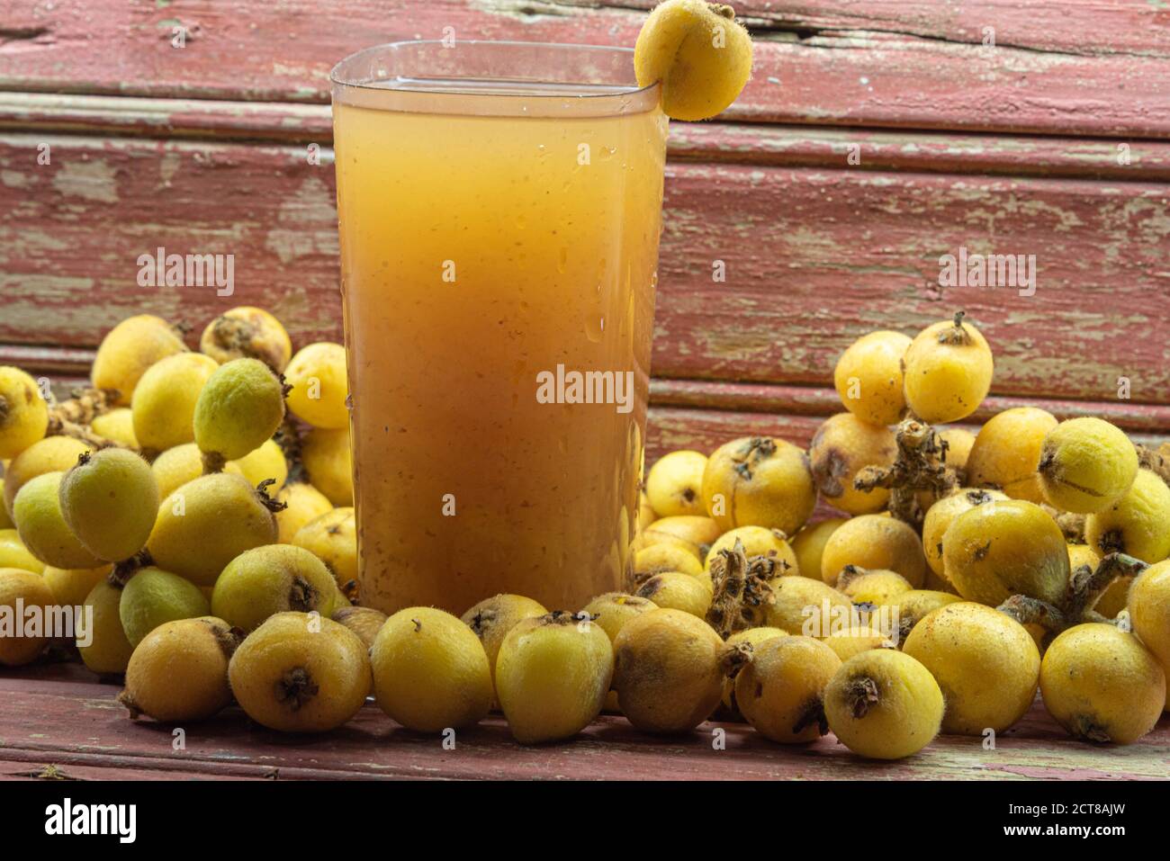 Yellow loquat juice. Refreshing drink and detox. Natural food. Exotic ...