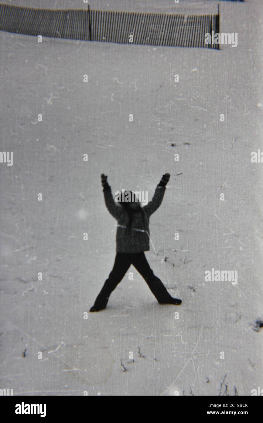 Fine 1970s vintage black and white photography of a young kid enjoying ...