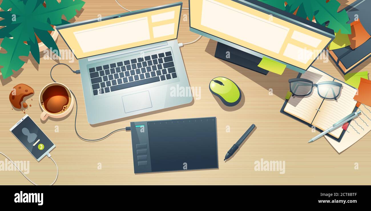 Top view of designer workspace with graphic tablet, laptop, monitor ...