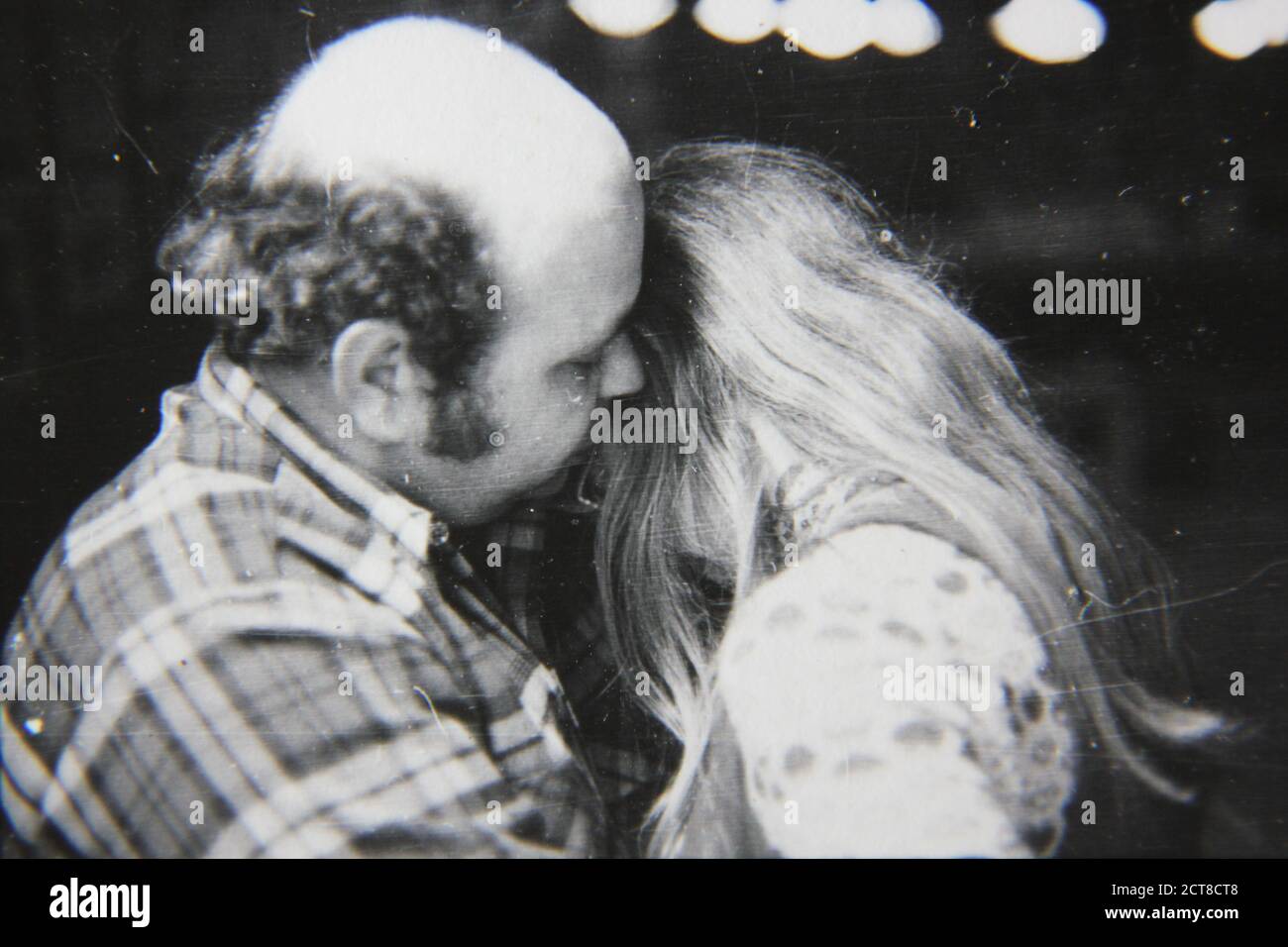 Fine 1970s black and white photography of a regular guy hugging a woman ...