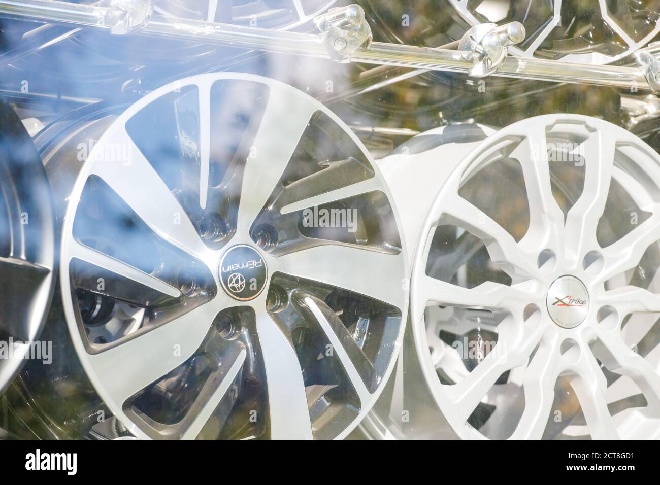 Russia Vyborg. 09.09.2020 Car rims in the shop window behind the glass ...