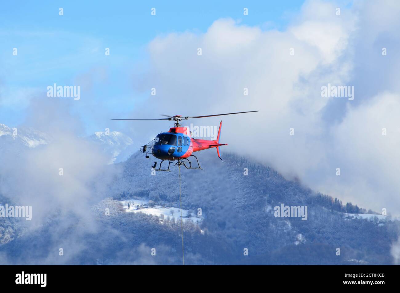 Helicopter Flying over Snow-capped Mountain in Switzerland Stock Photo ...