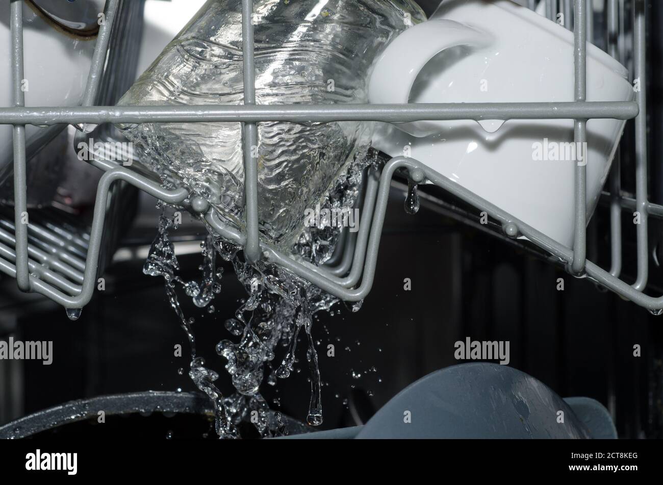 Dirty Dishes in the Washing Machine Stock Photo - Alamy