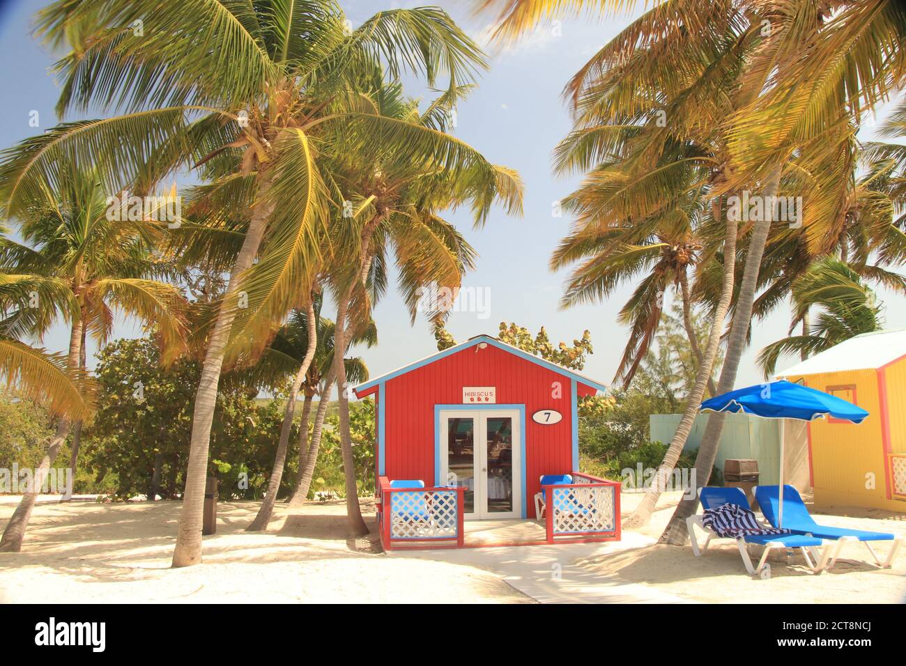 Colorful cabanas and lounge chairs along the beach at Princess Cays in ...