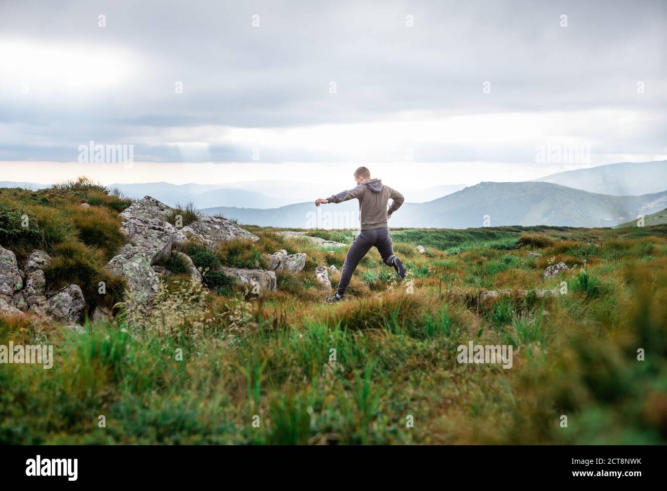 Strong young man jump hi-res stock photography and images - Alamy